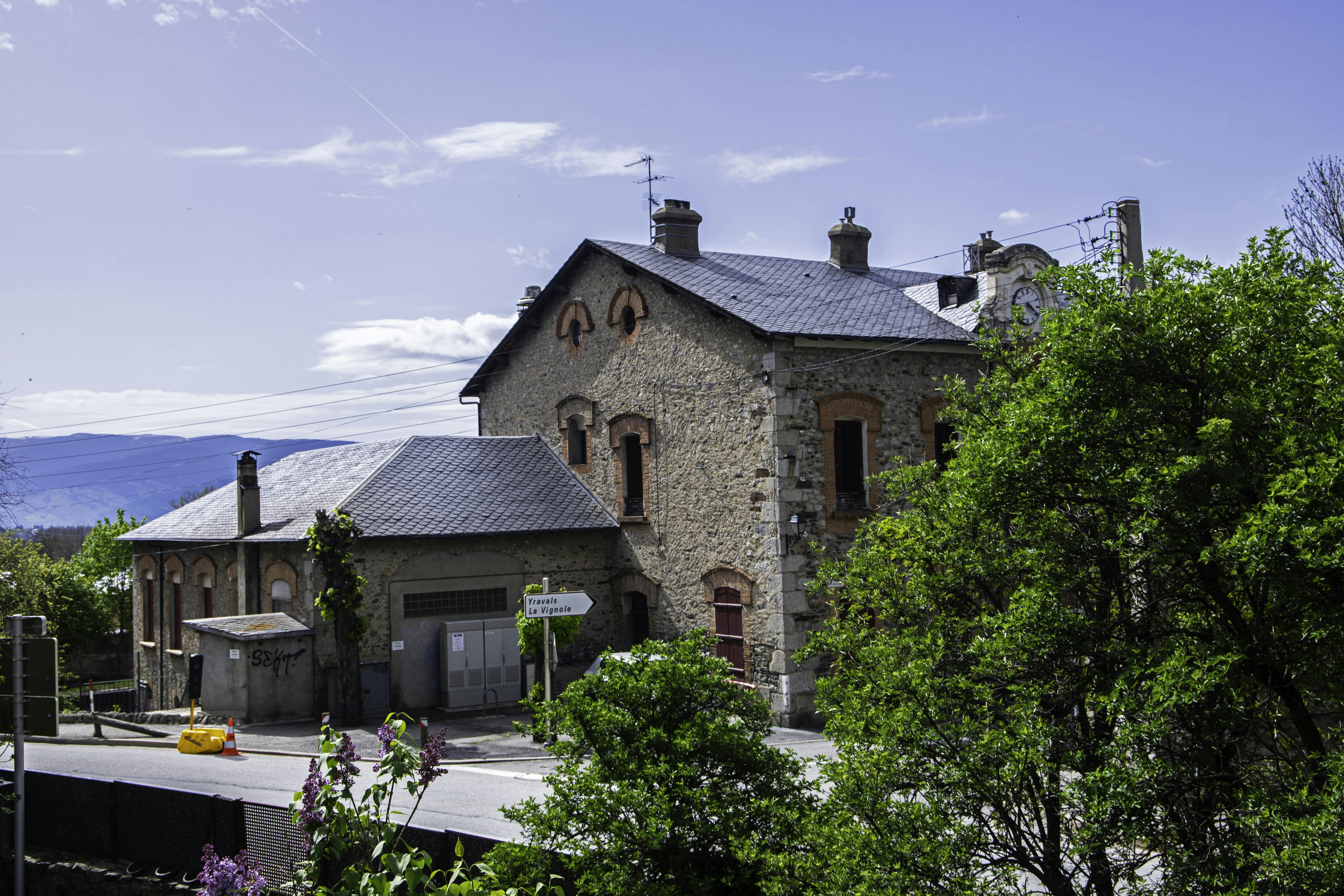 Stone Cottage Beneath a Bright Alpine Sky