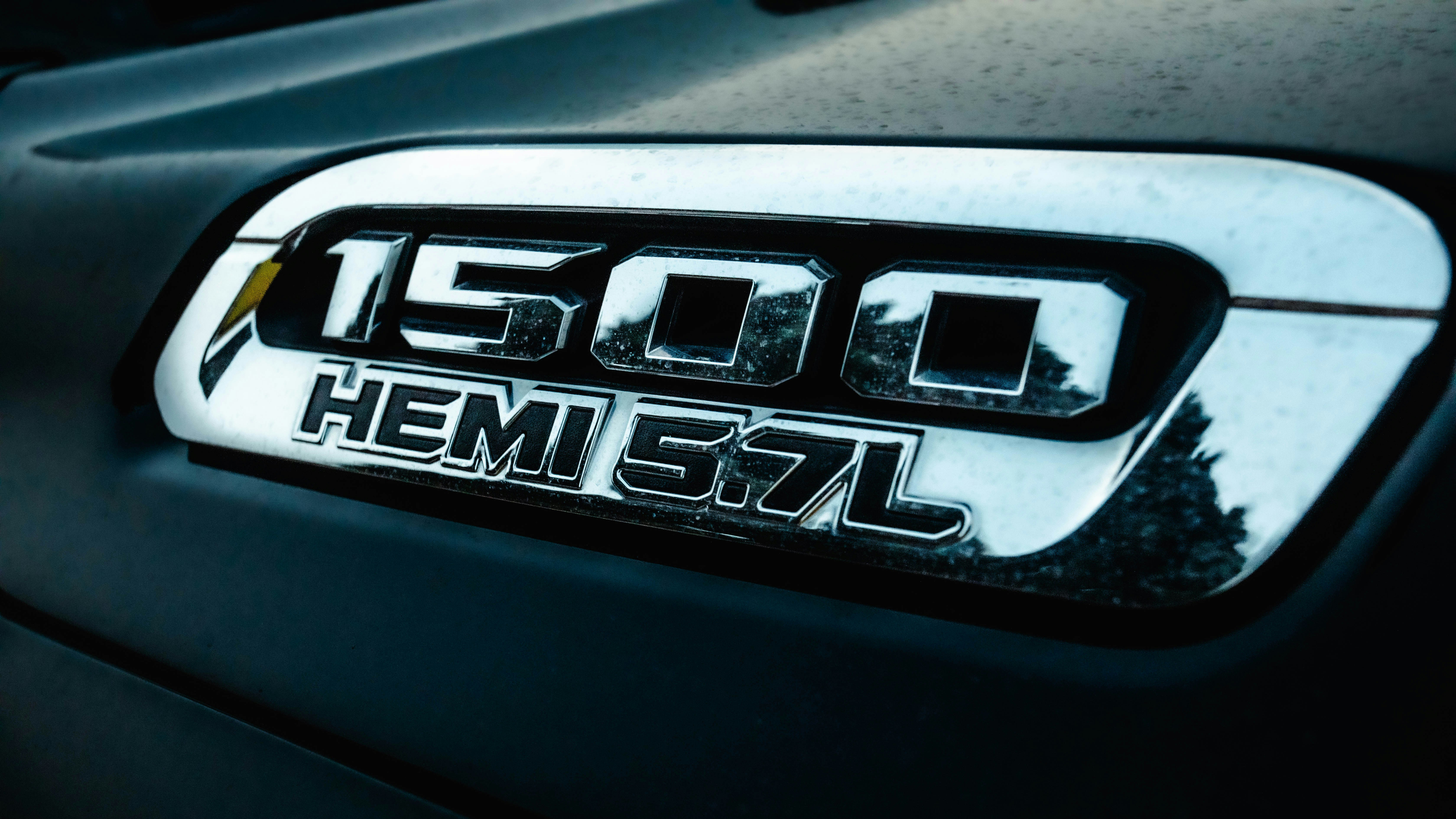 Chrome Emblem Grasp: A close-up of a vehicle badge