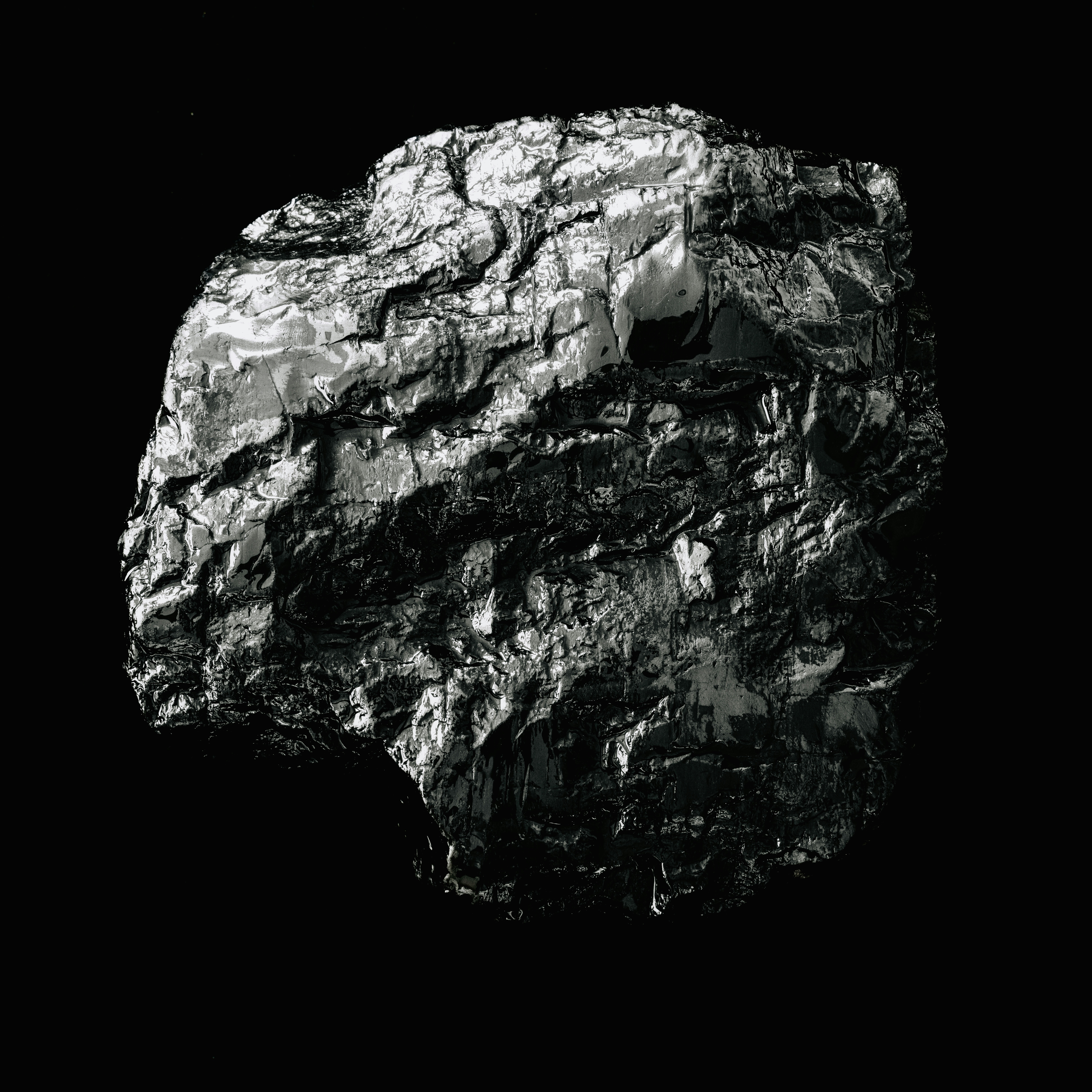 Gleaming Fragment: Monochrome Rock Beside Infinite Black