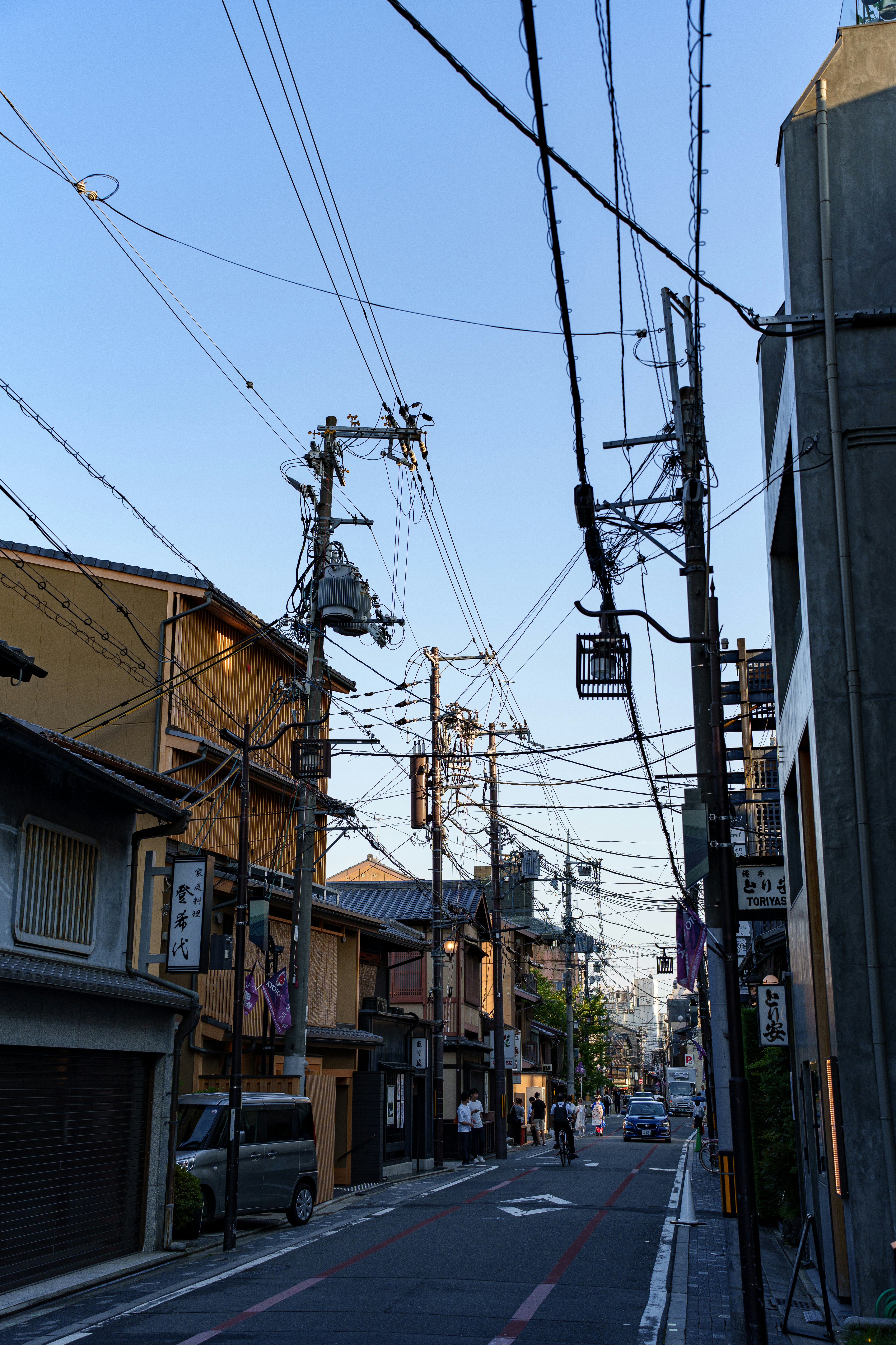 City of Lines: A Narrow Tokyo Street Framed by Tangled Wires