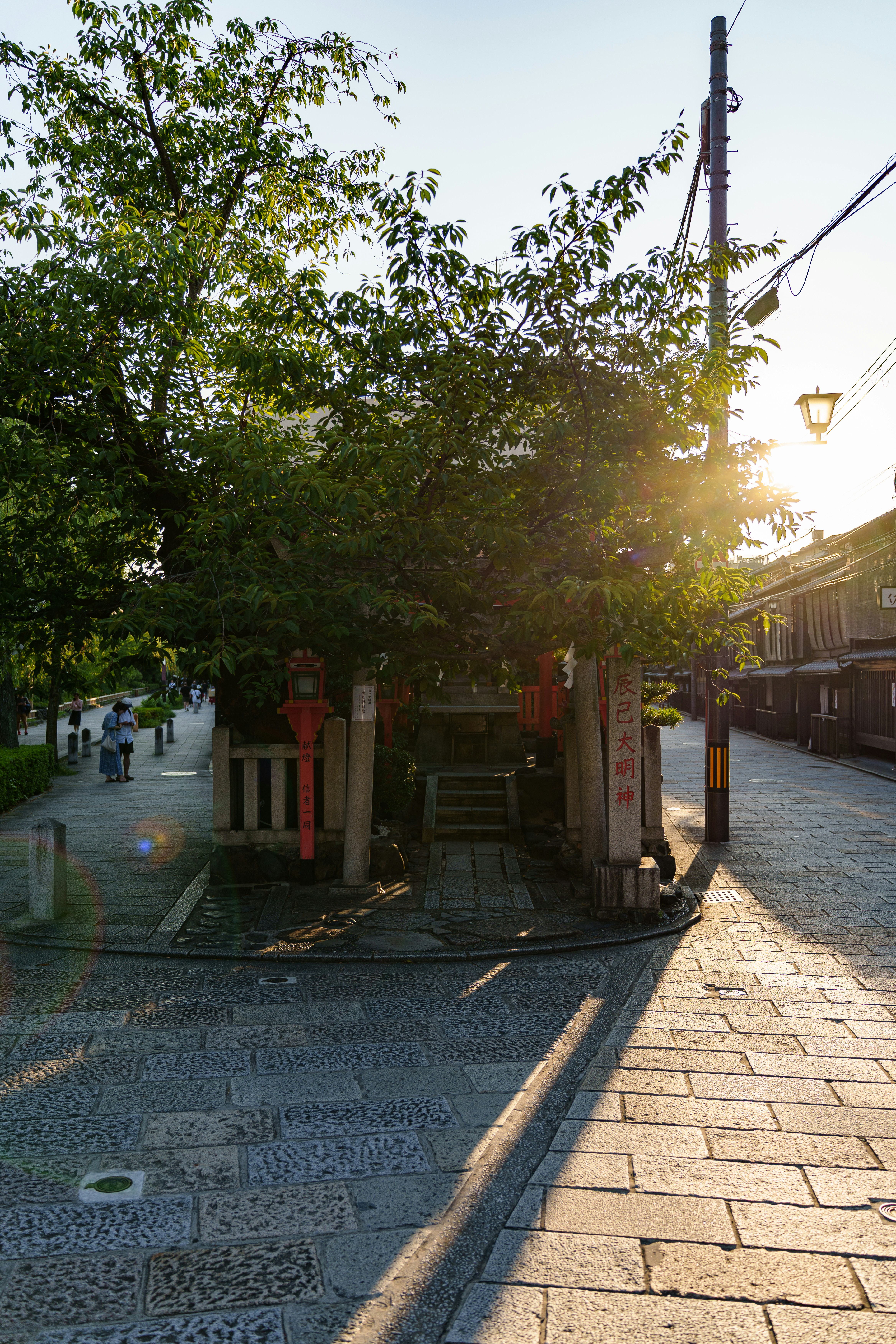 Sunlit Lanterns Near the Alley: A Quiet Street Scene Unfolding