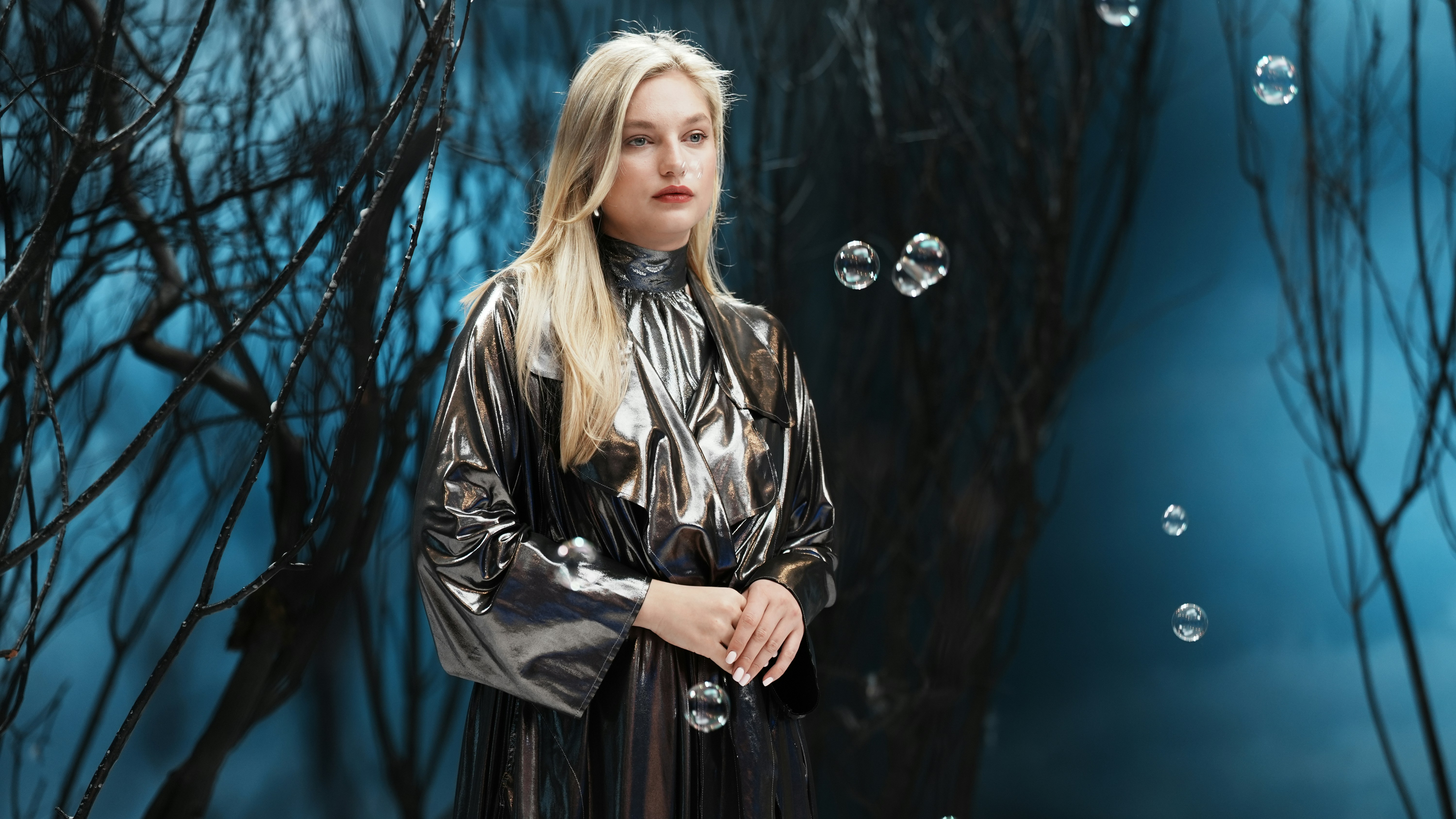 Reflective Silence: Blonde Portrait in a Velvet Night