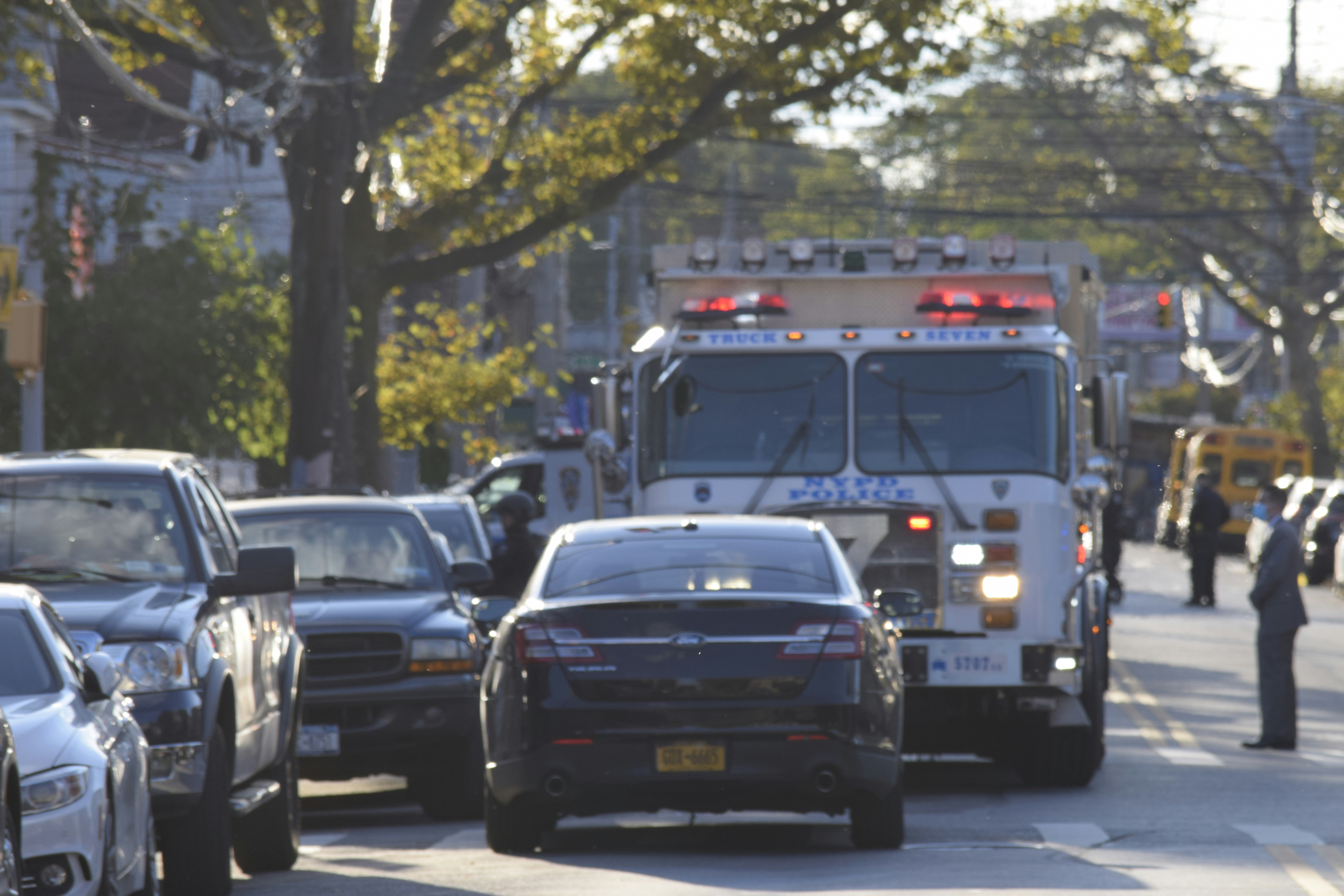Emergency Lane: A Car, an Ambulance, and a Quiet Street