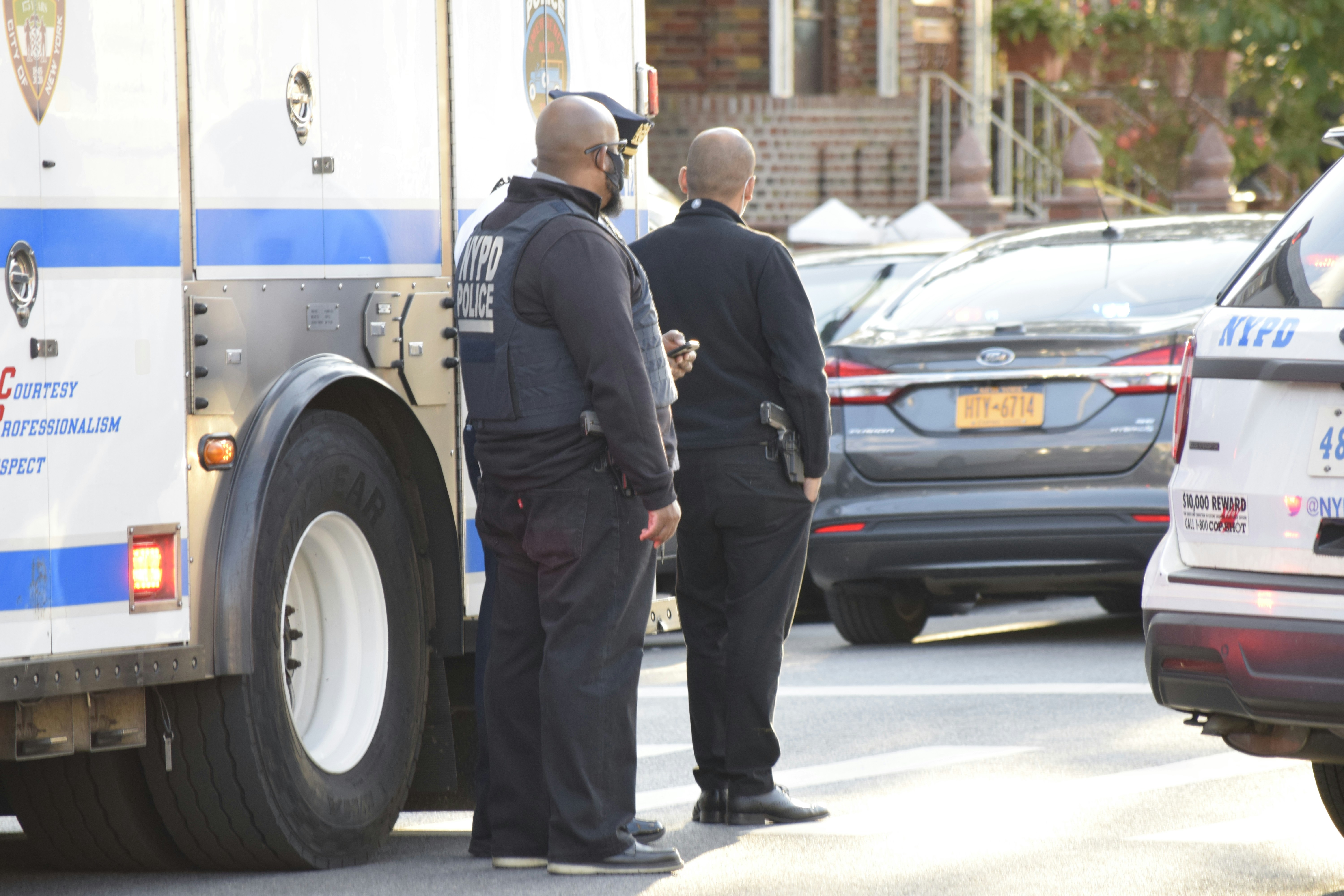 Two Officers at a Car Blockade: A Street Scene of Police Presence