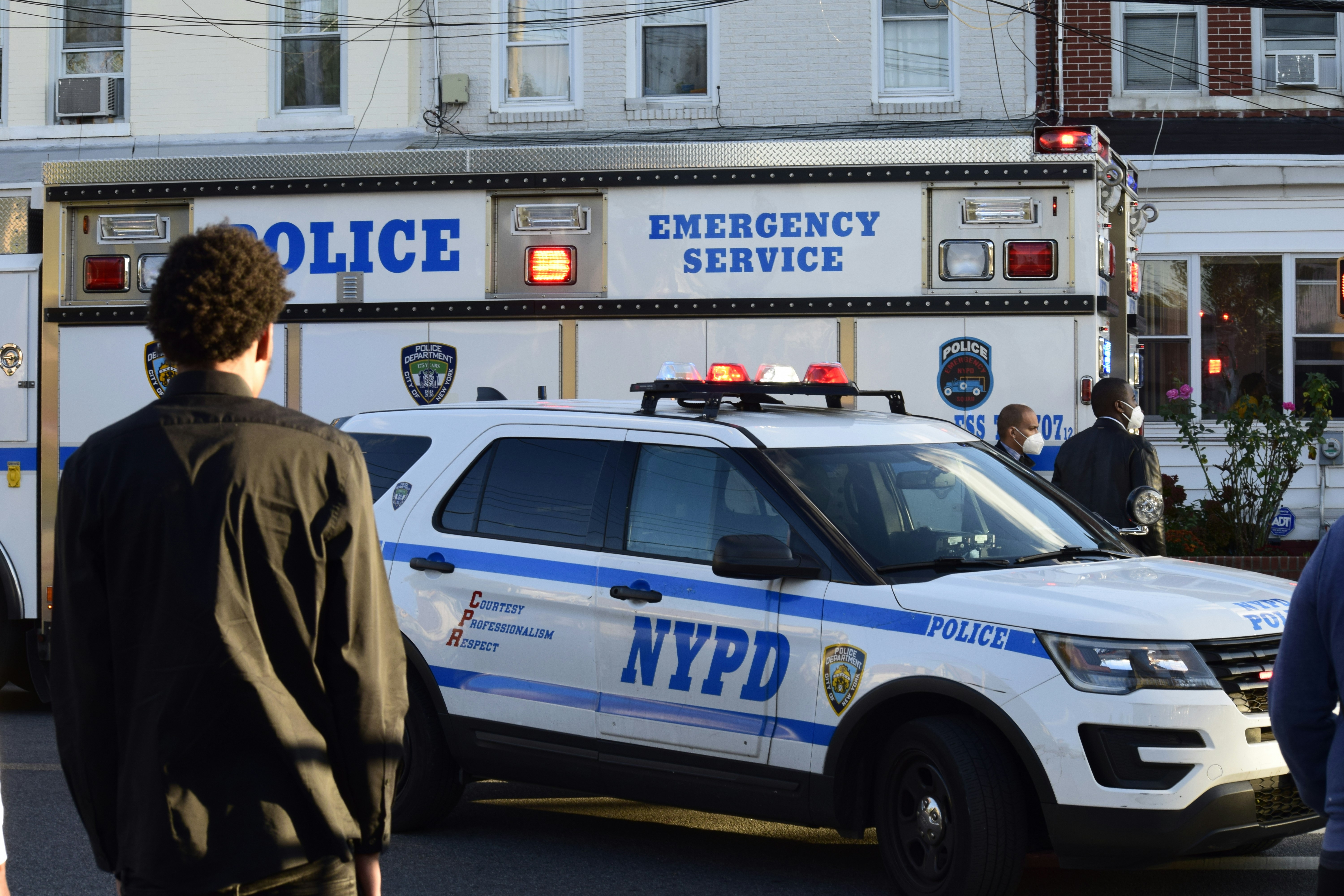 Onlookers Meet the Line of Duty: NYPD Scene Unfolds