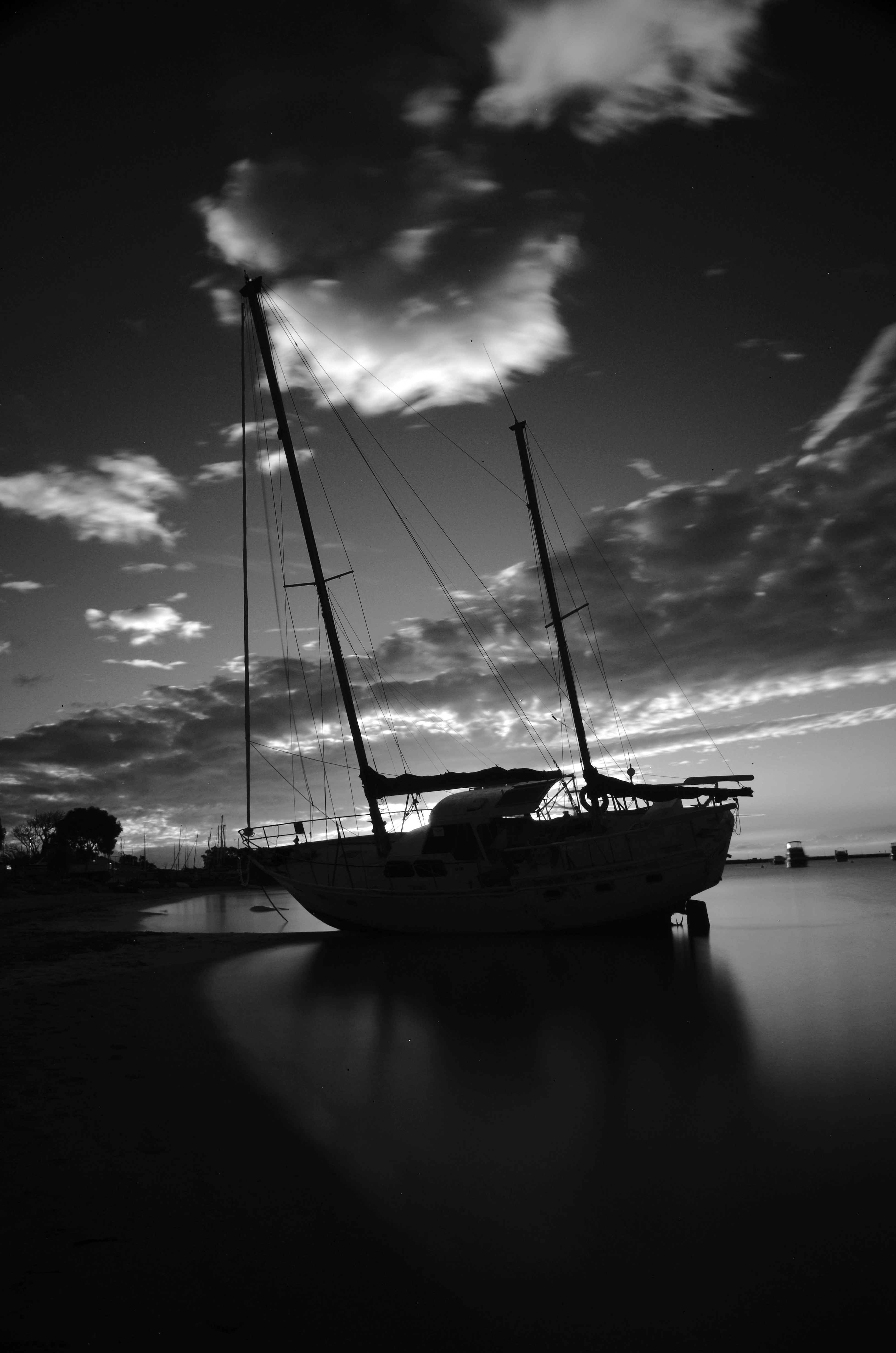 Silent Vessel at Dusk: A Black-and-White Harbor Portrait