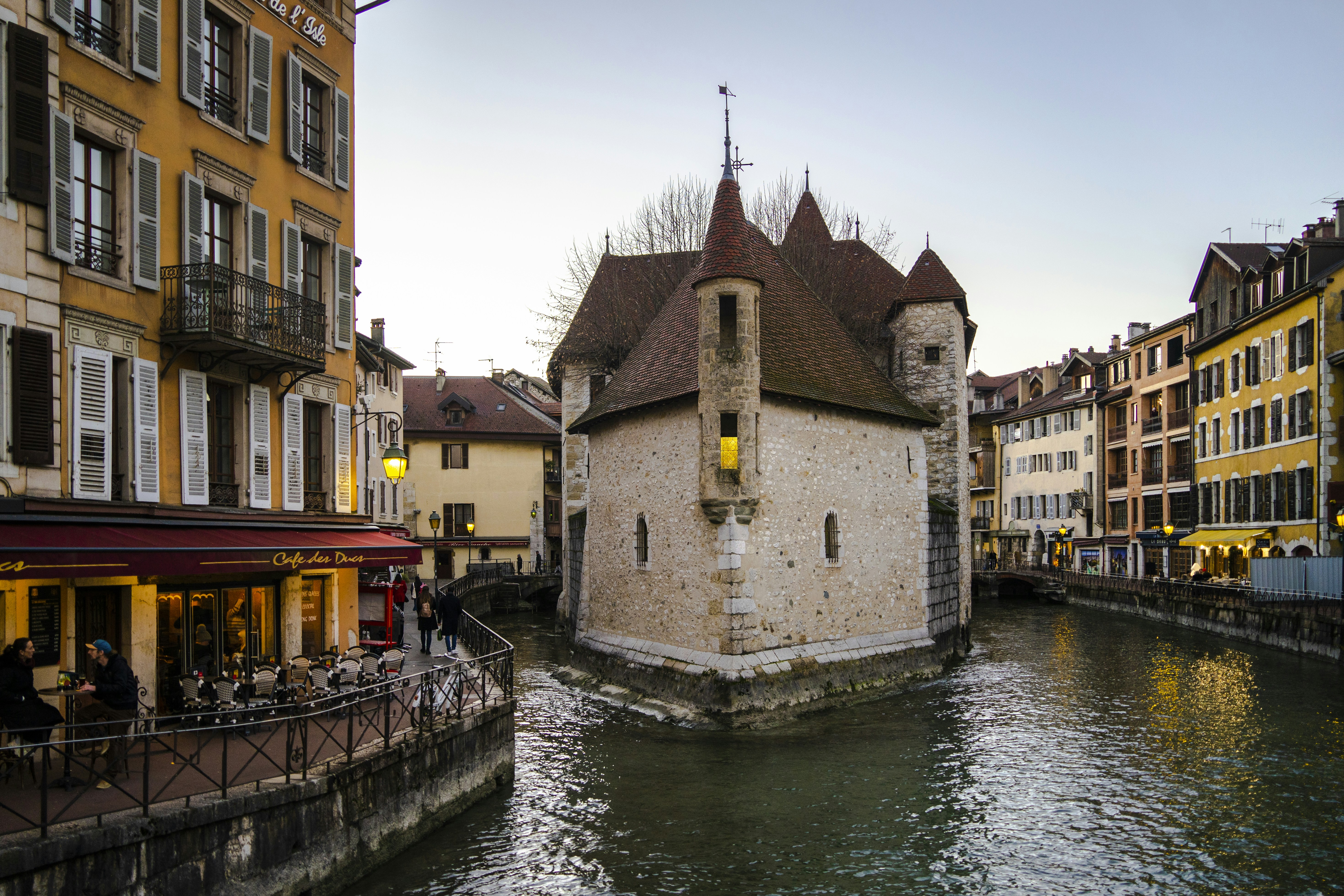Colorful riverside village with a medieval island tower
