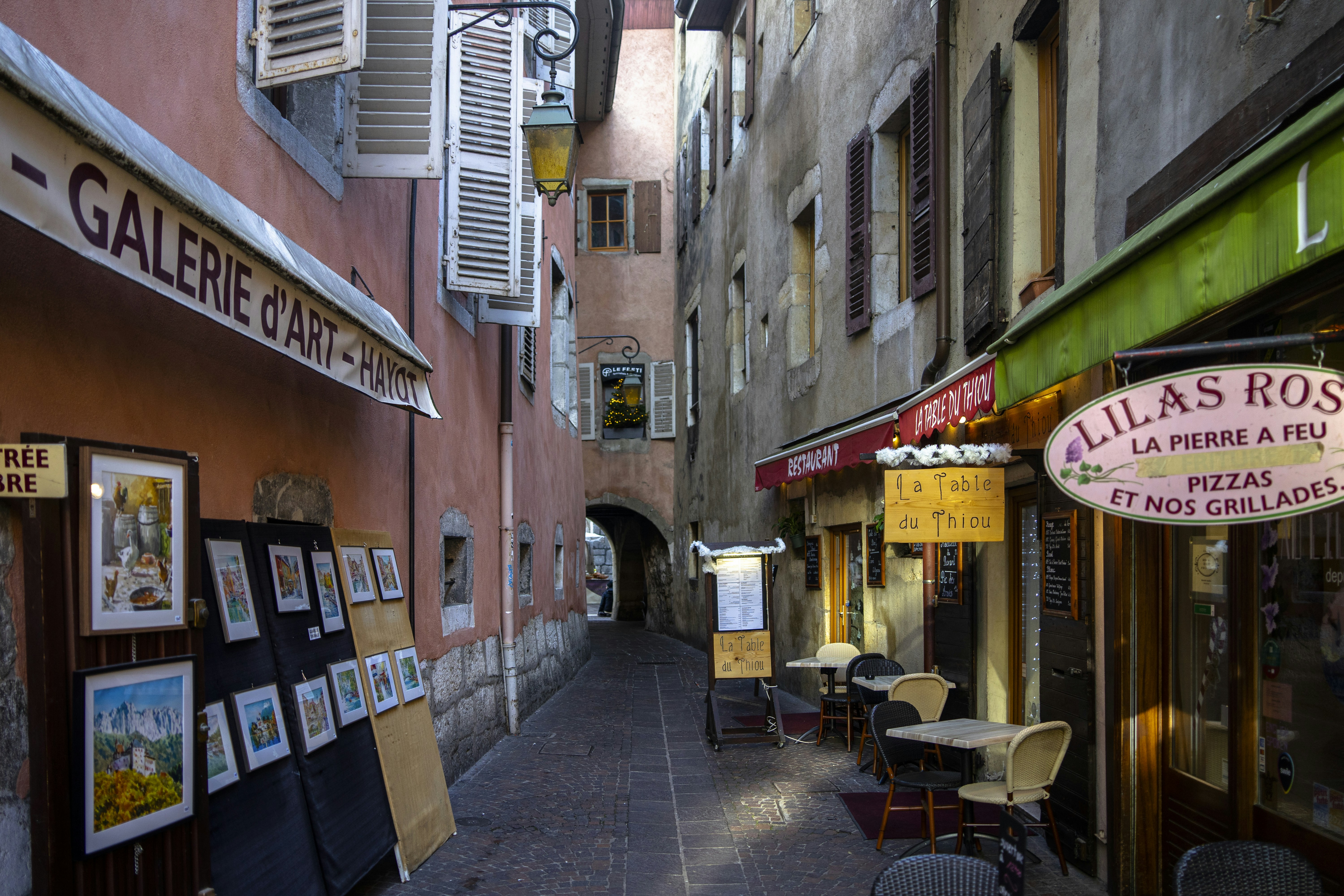 Alleyway Gallery: Stone-paved Passage Between Colorful Shops