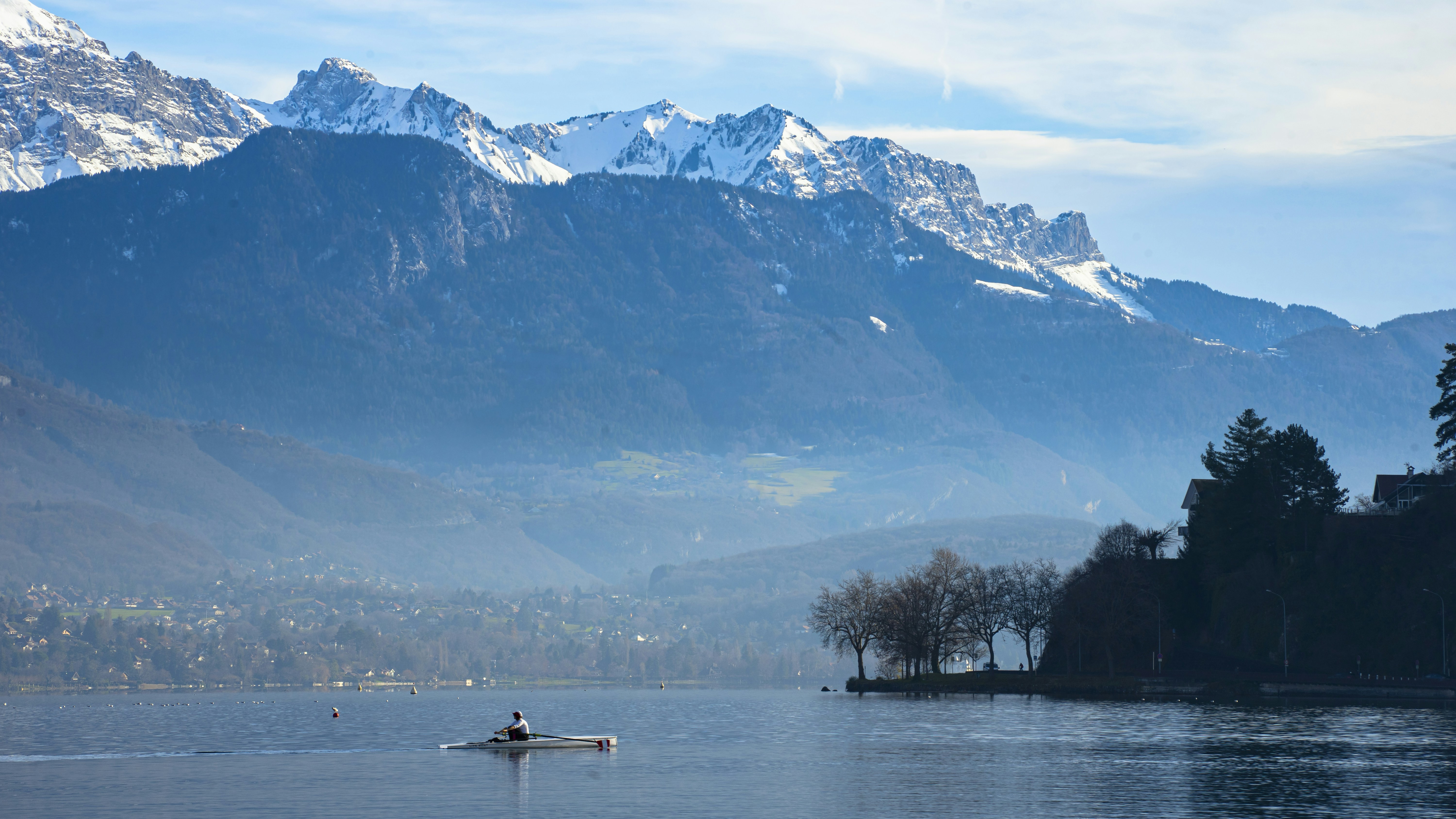 Serene Alpine Lake Under Snow-Wedged Peaks