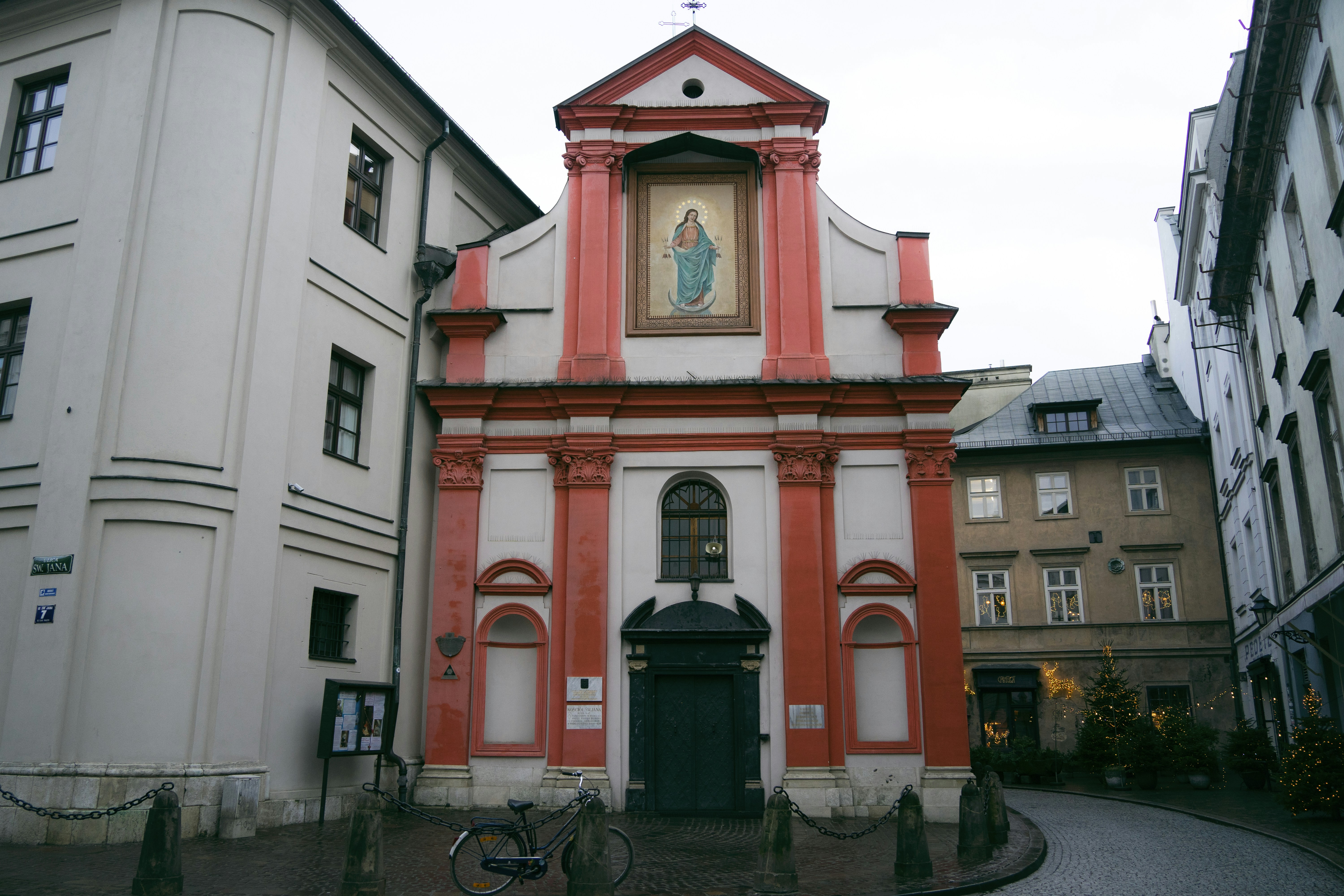 Baroque Chapel Façade framed by narrow European alley