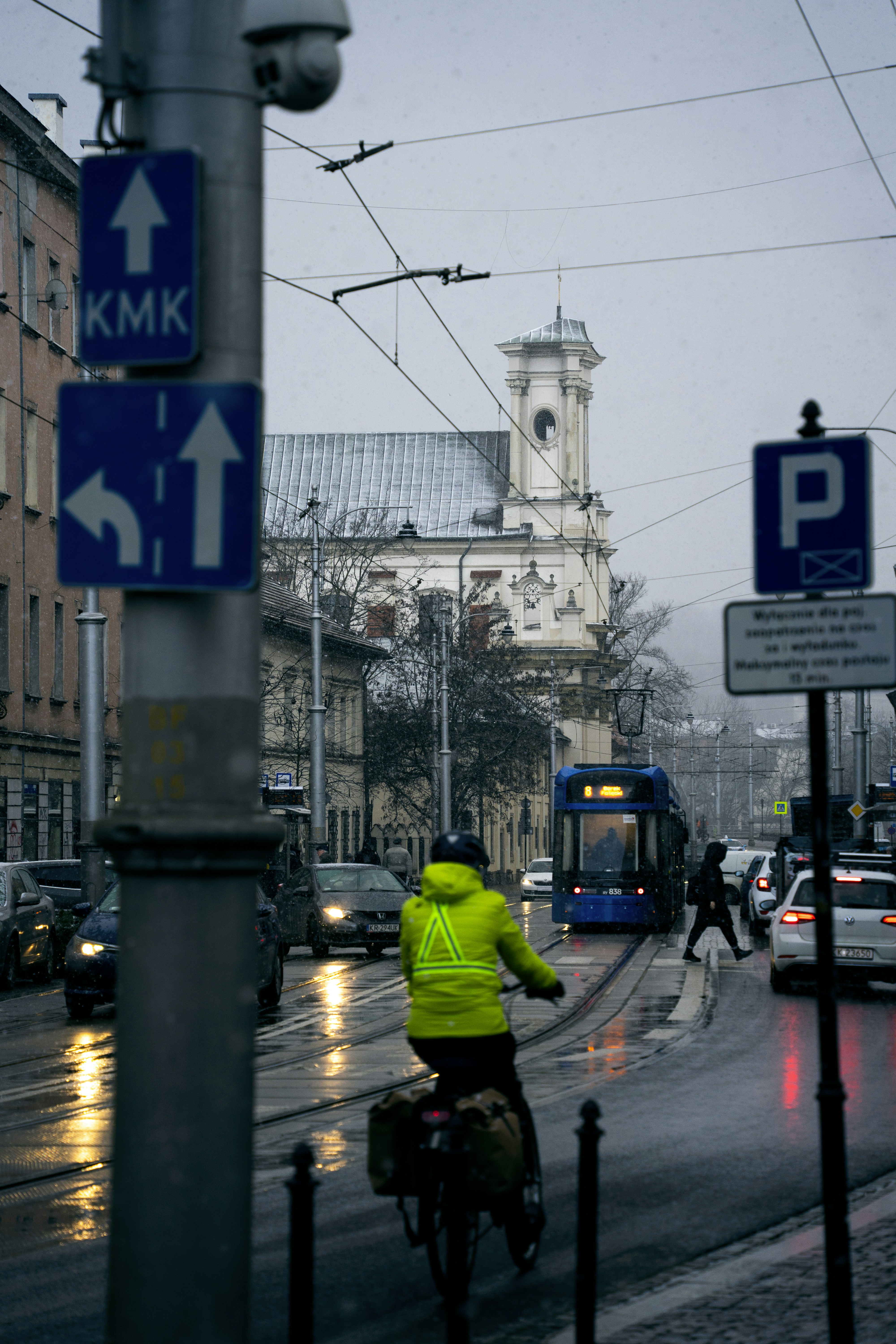 Neon Trail: City Street Car and Cyclist in Rain