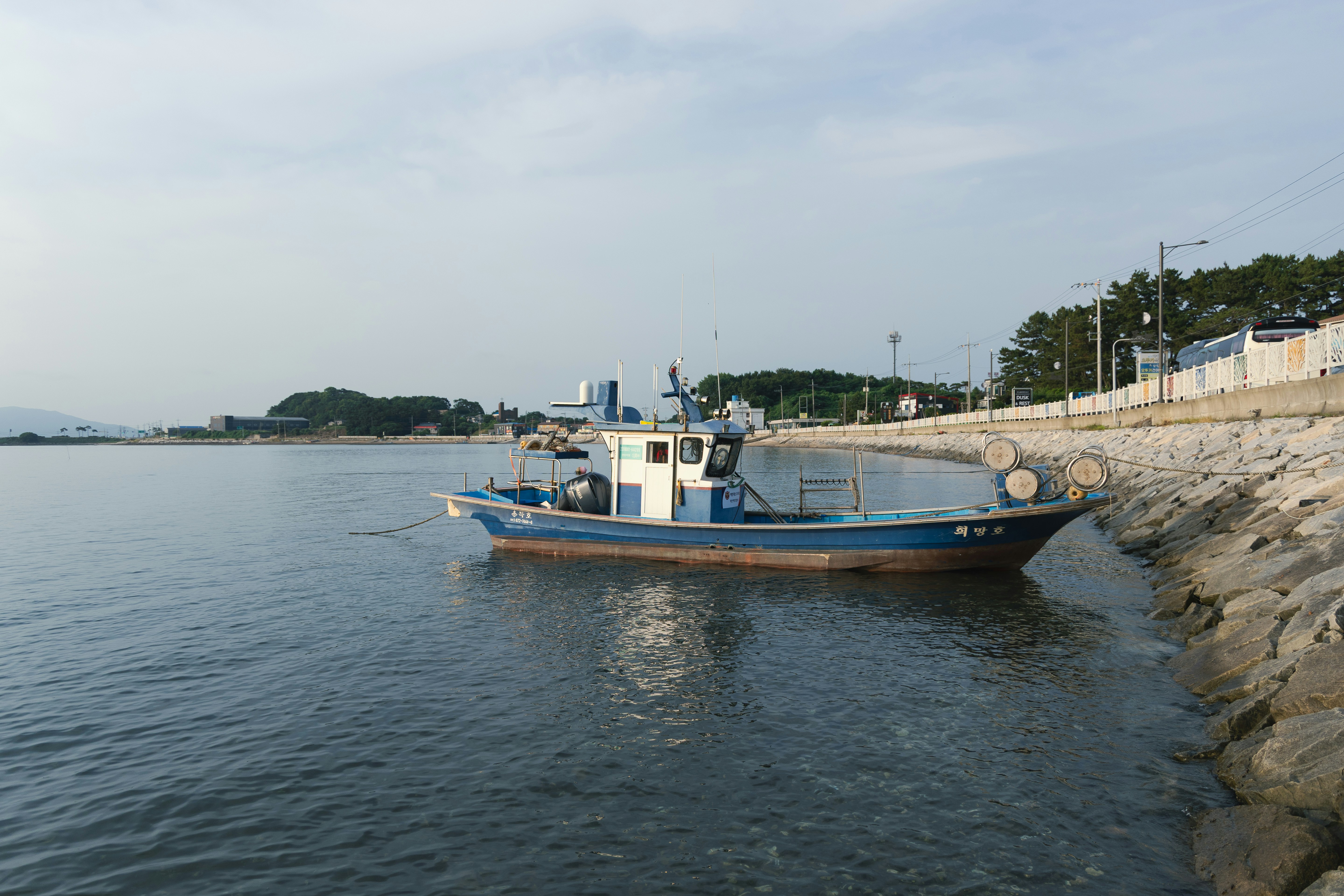 Harbor Vessel at Quiet Breakwater