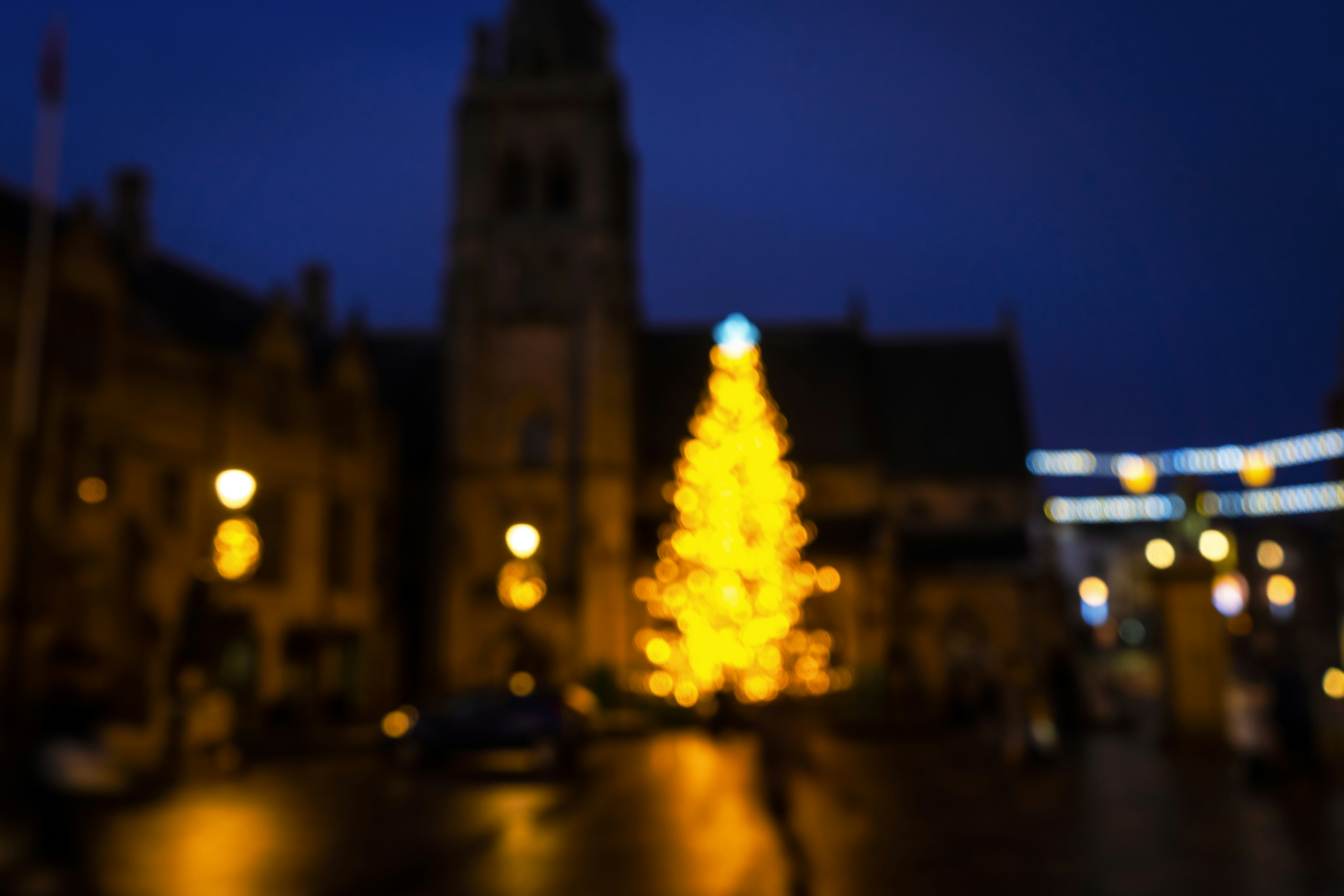 Glowing Tree in a Quiet Town Square at Blue Hour