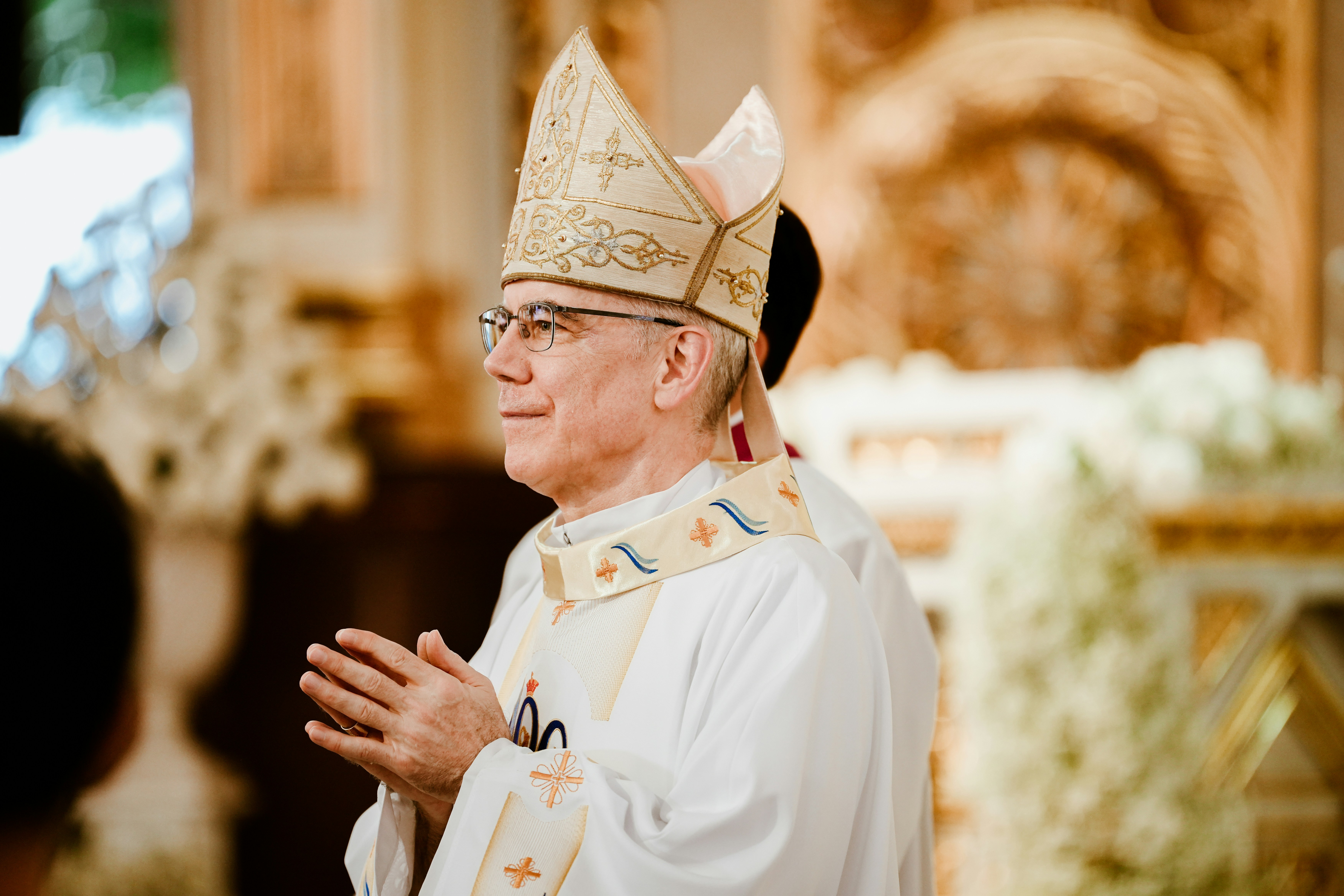 Ritual of Respect: A Cleric in Serene Demeanor Amid Sacred Grandeur