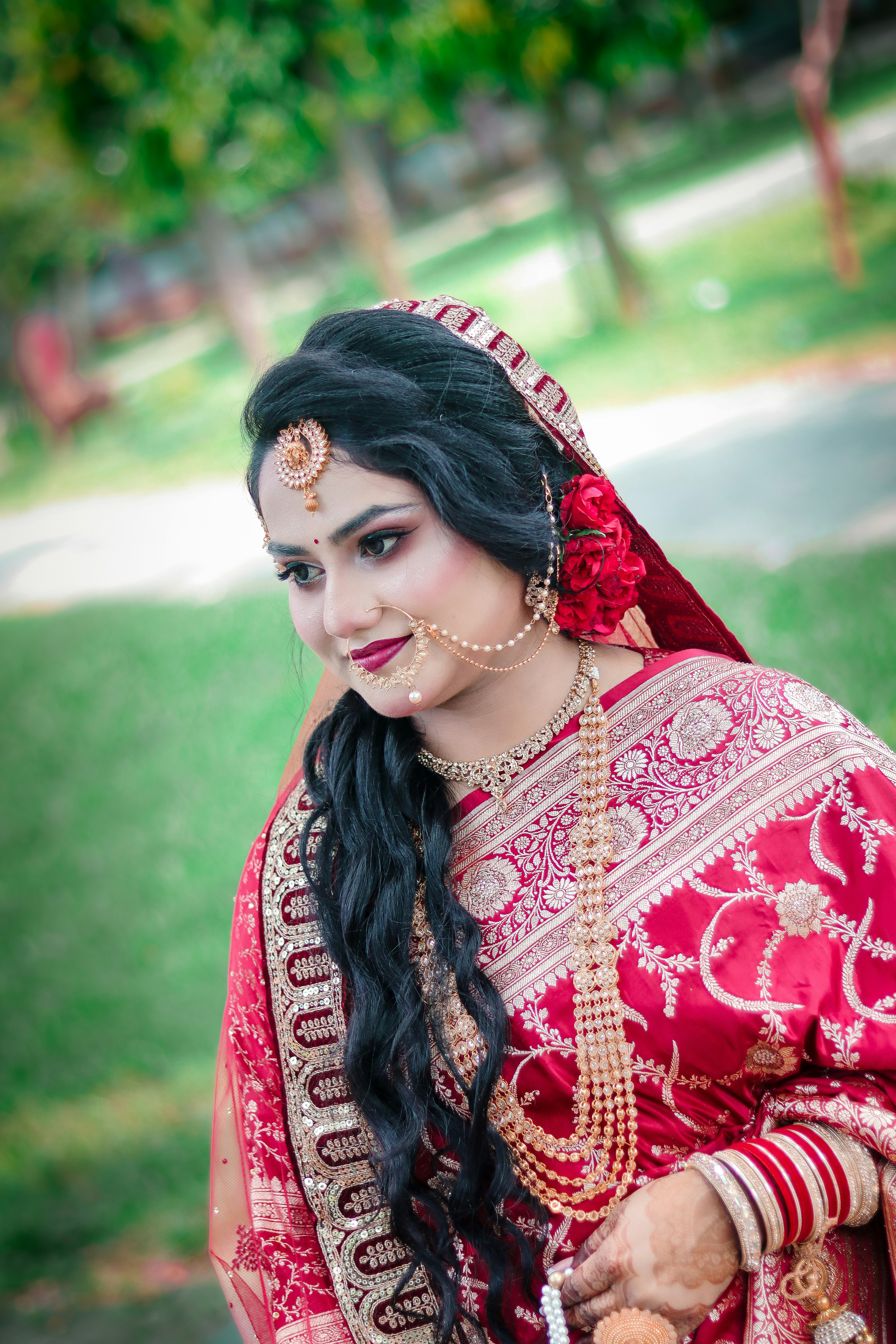 Regal Bride in Red: Adorned with Gold and Grace