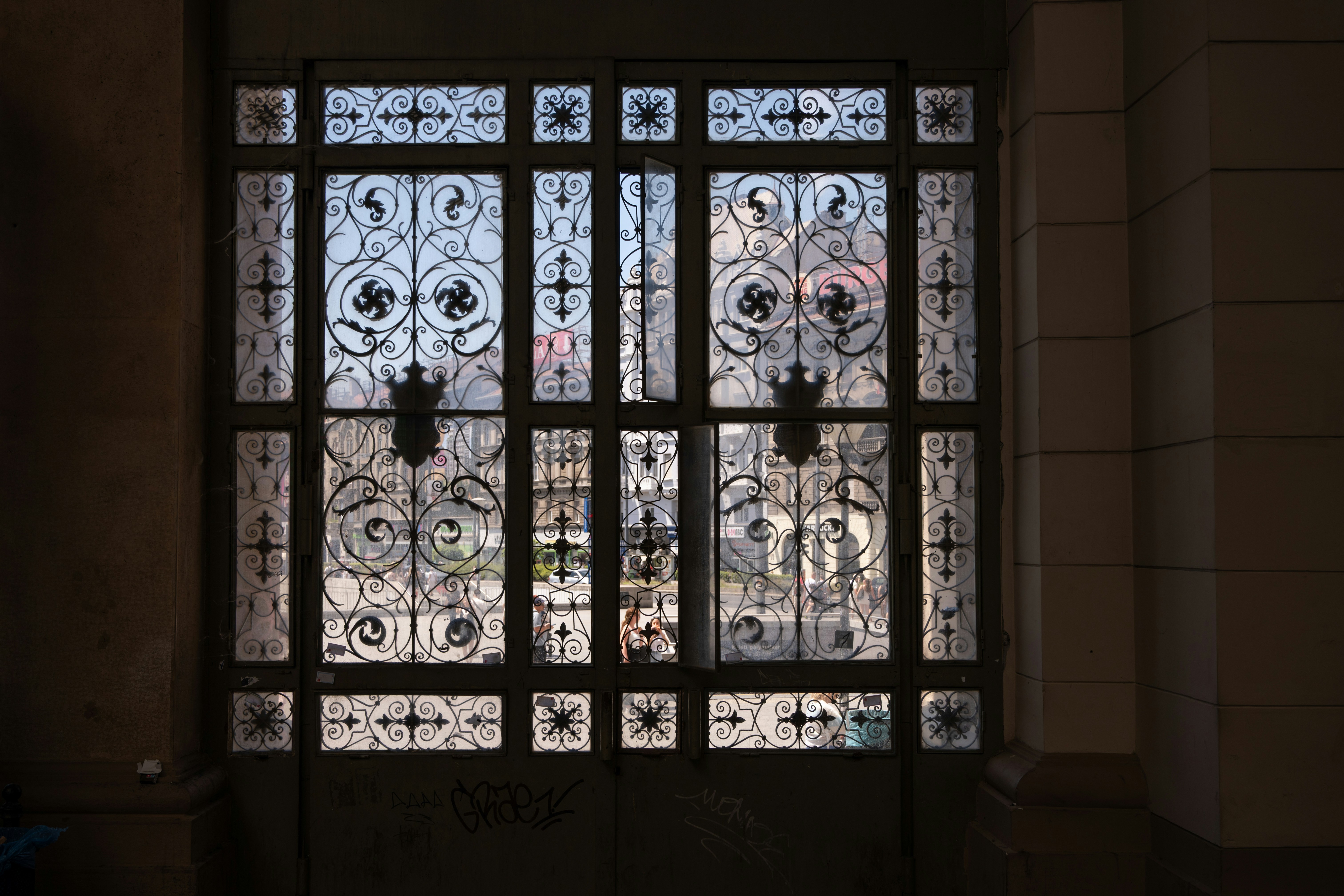 Intricate Ironwork Framing a Street Scene