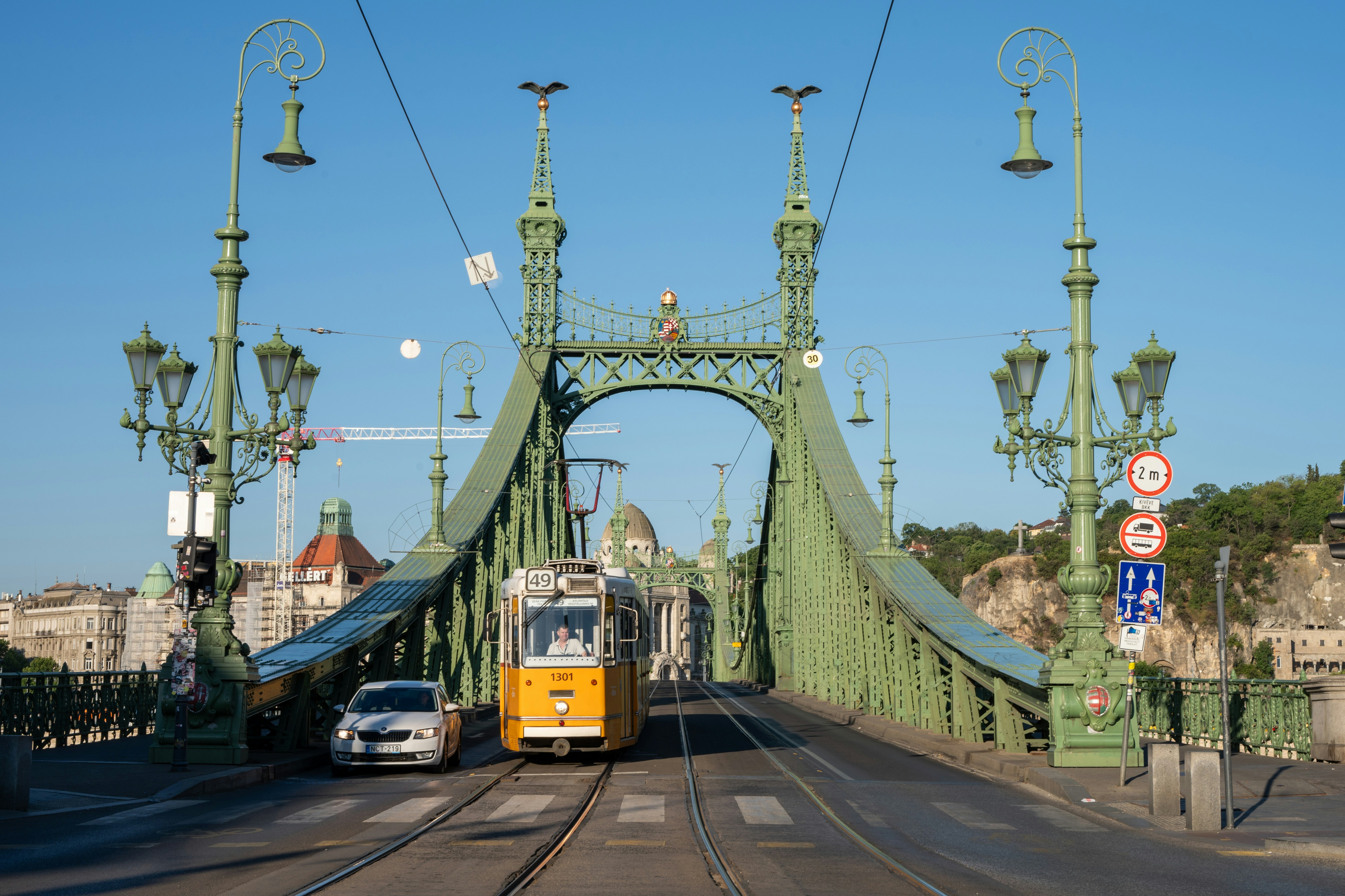 Yellow Tram Crossing the Green Chain: A Budapest-Style Bridge in Full Light