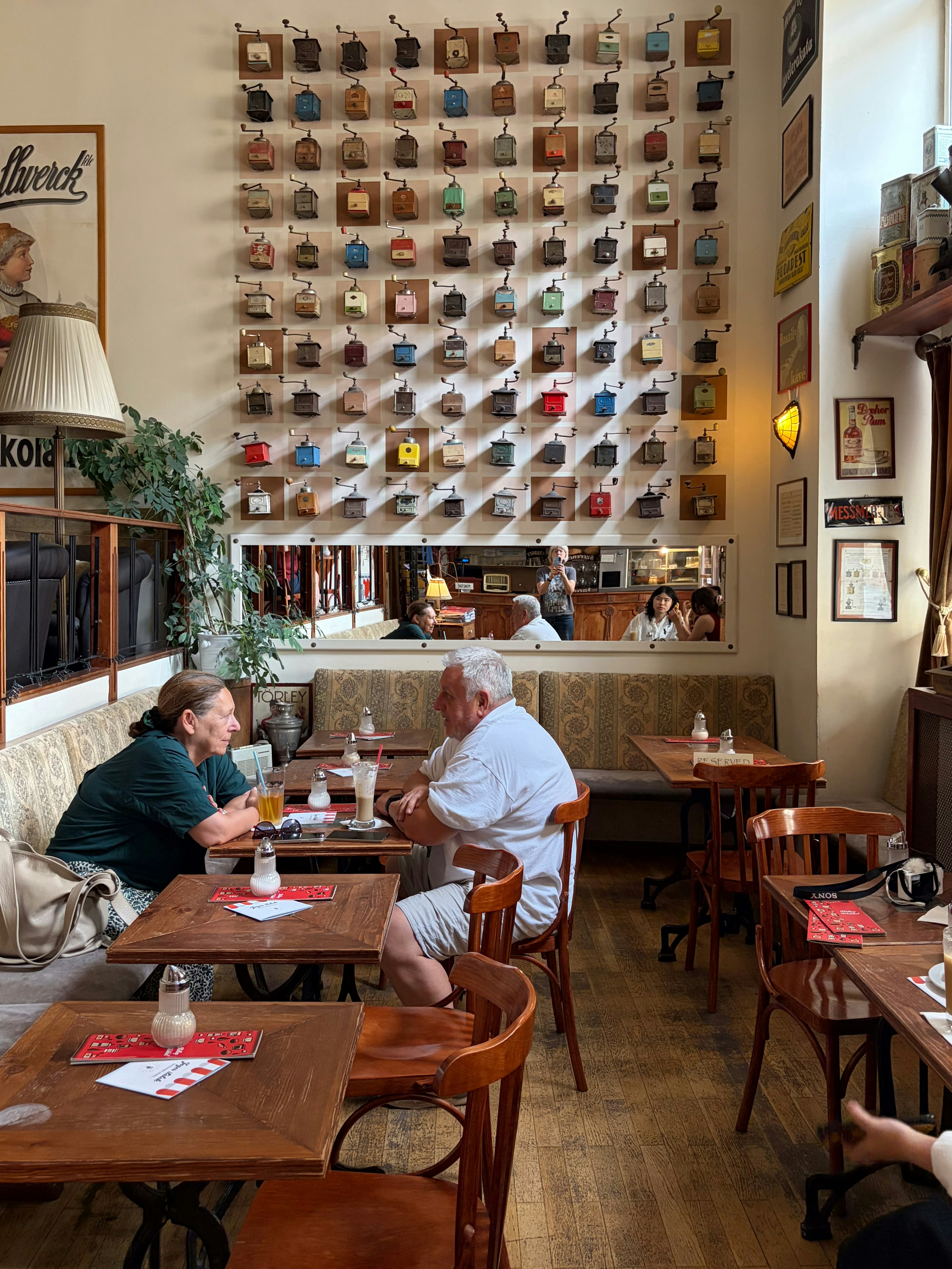Café Conversations Under a Gallery of Colorful Kreations