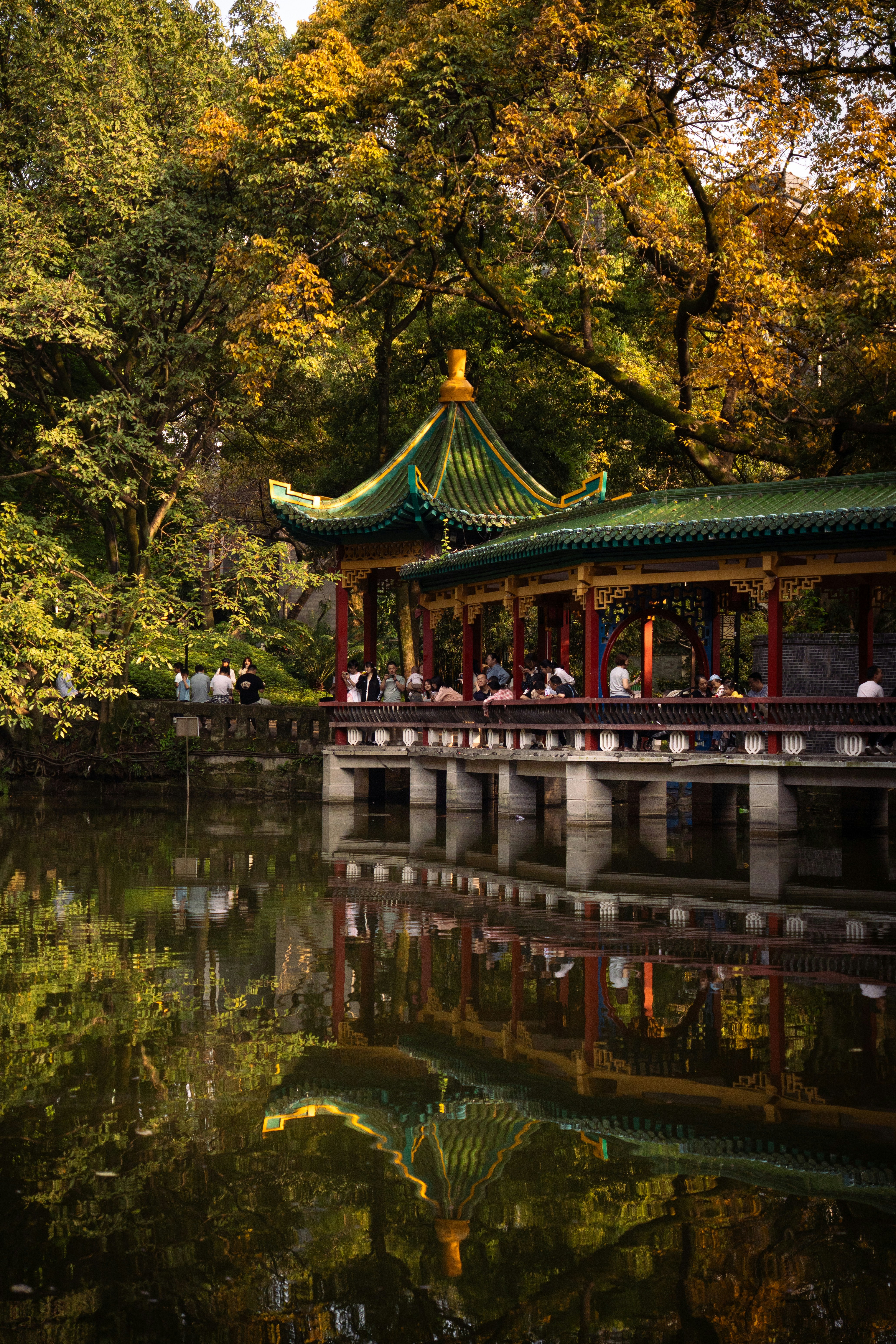 Autumn Pavilion by the Water: Golden Roofs and Reflections