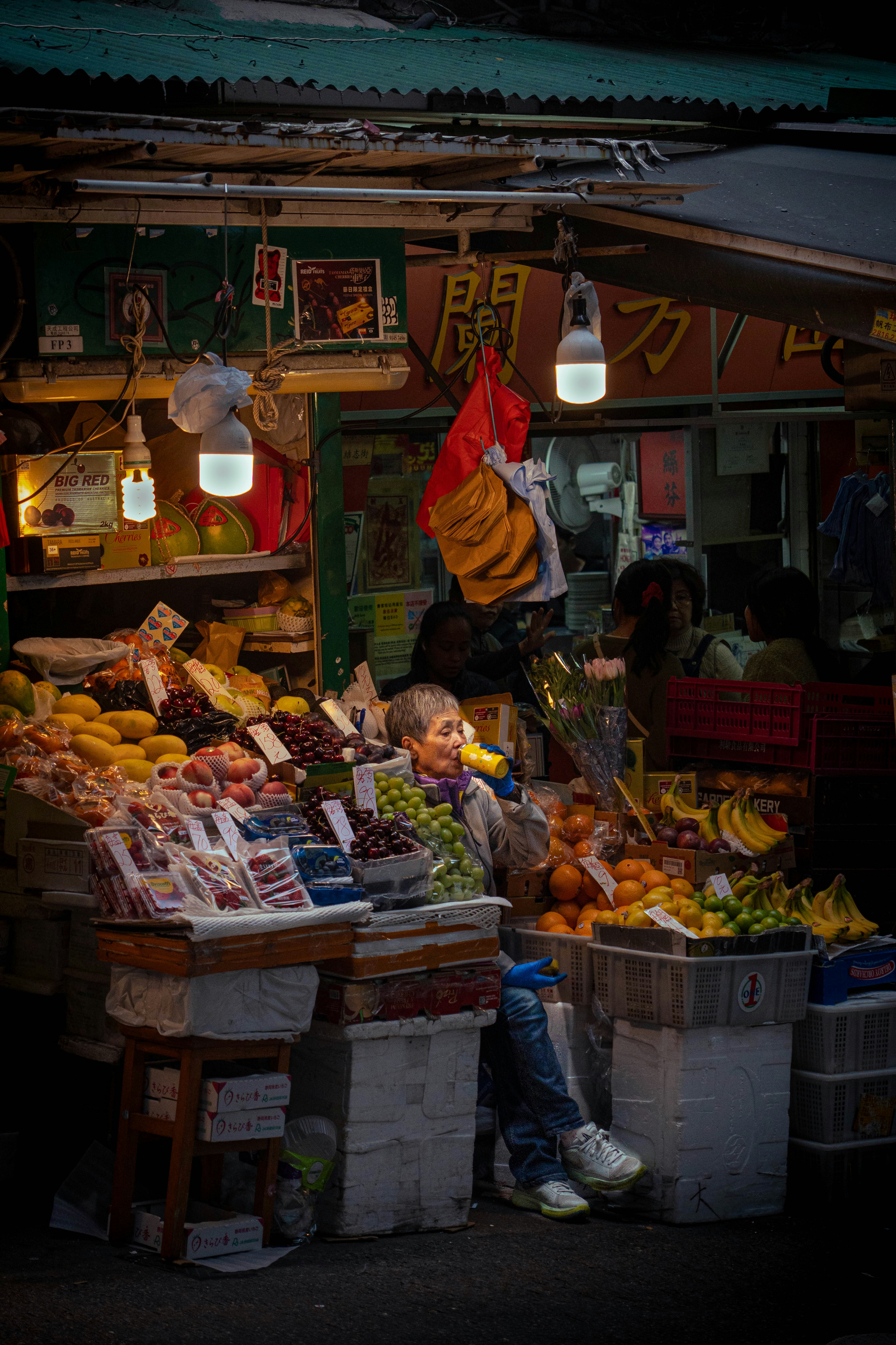 Market Portrait: A Casual Gaze Between Produce and Blue-Sneakered Rest