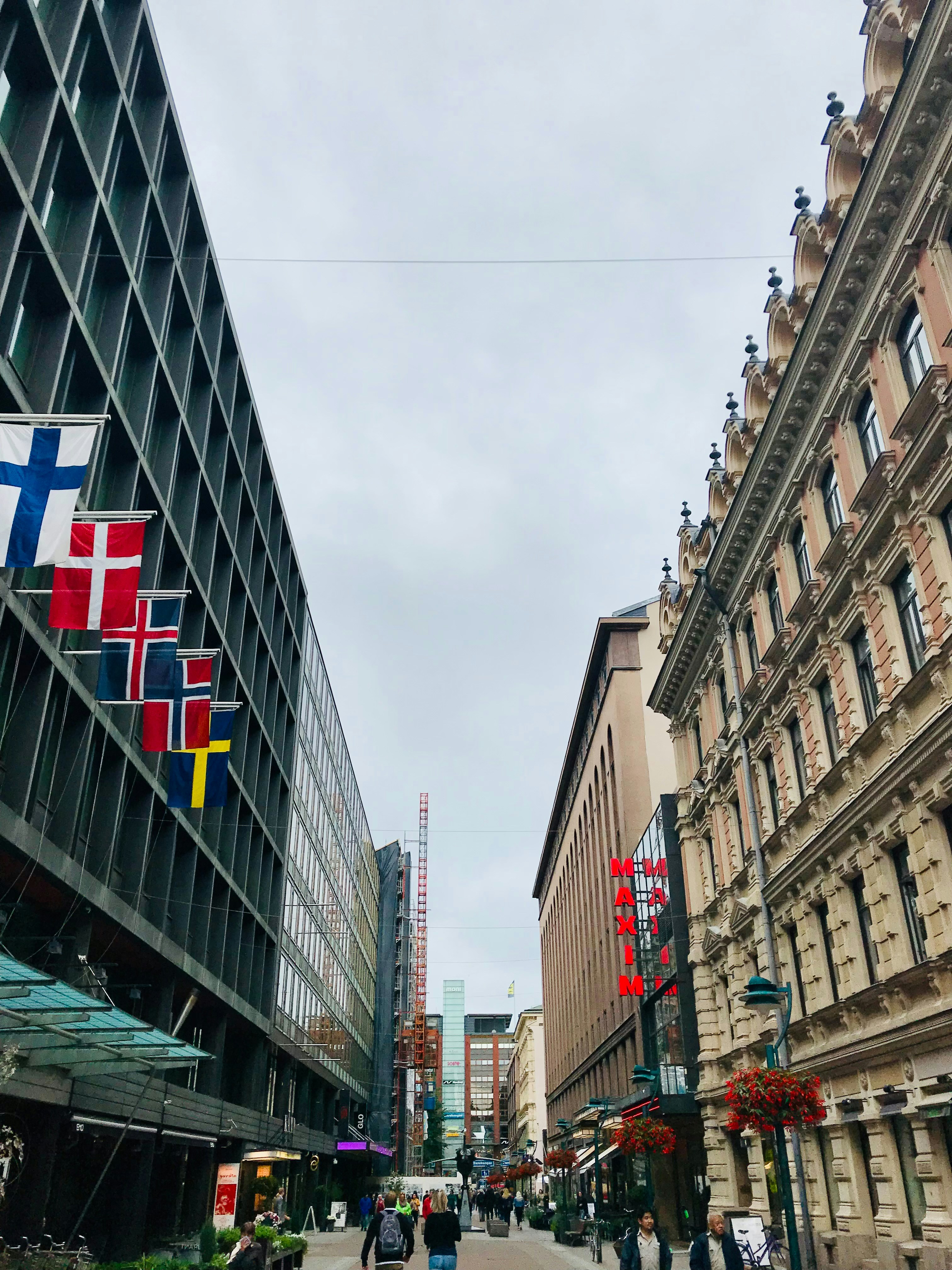 A European Street Framed by Modern Glass and Historic Facades
