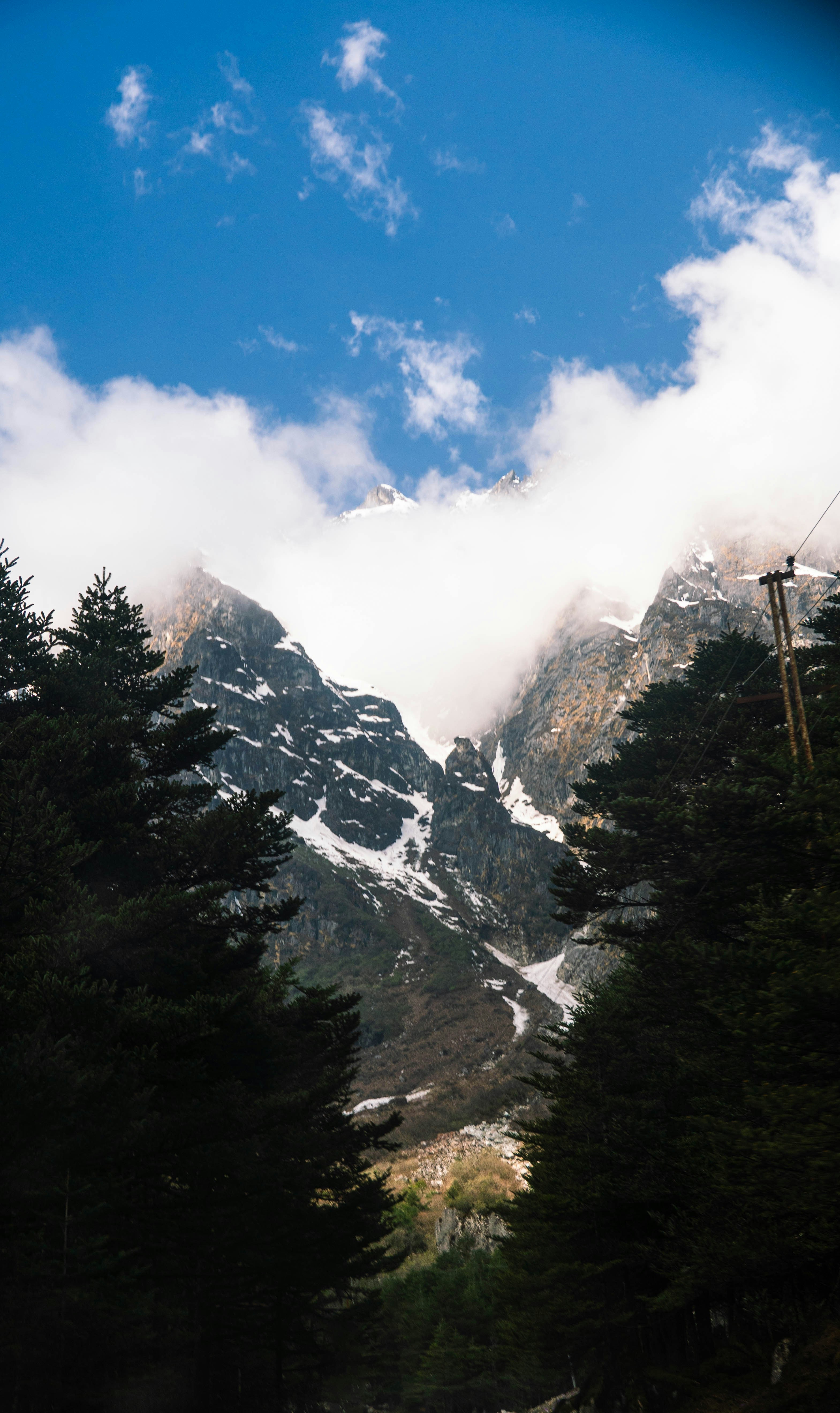 Peak Veil: Cloud-Clad Summit Rise