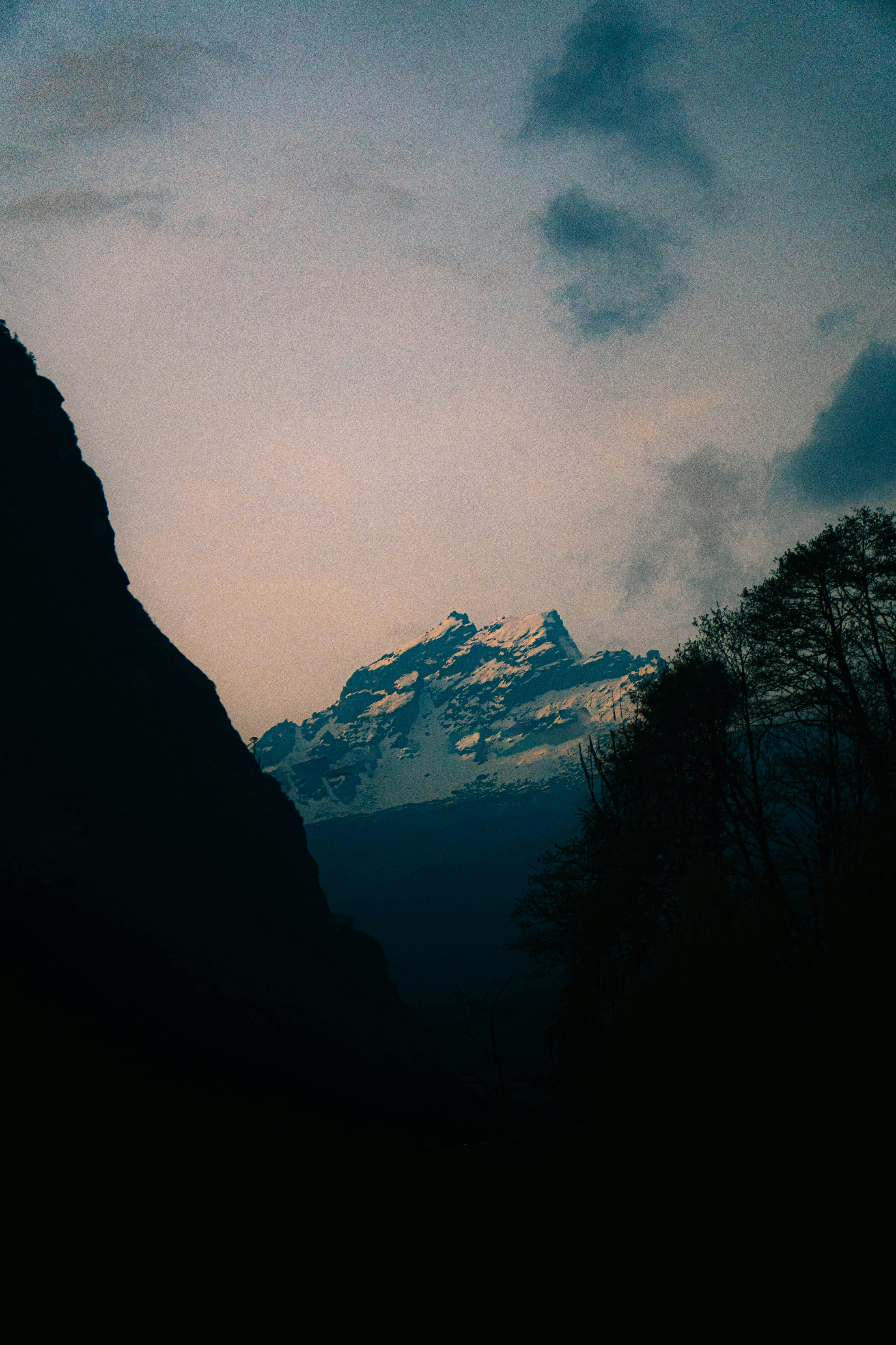 Sunlit Peak Between Shadowed Valleys