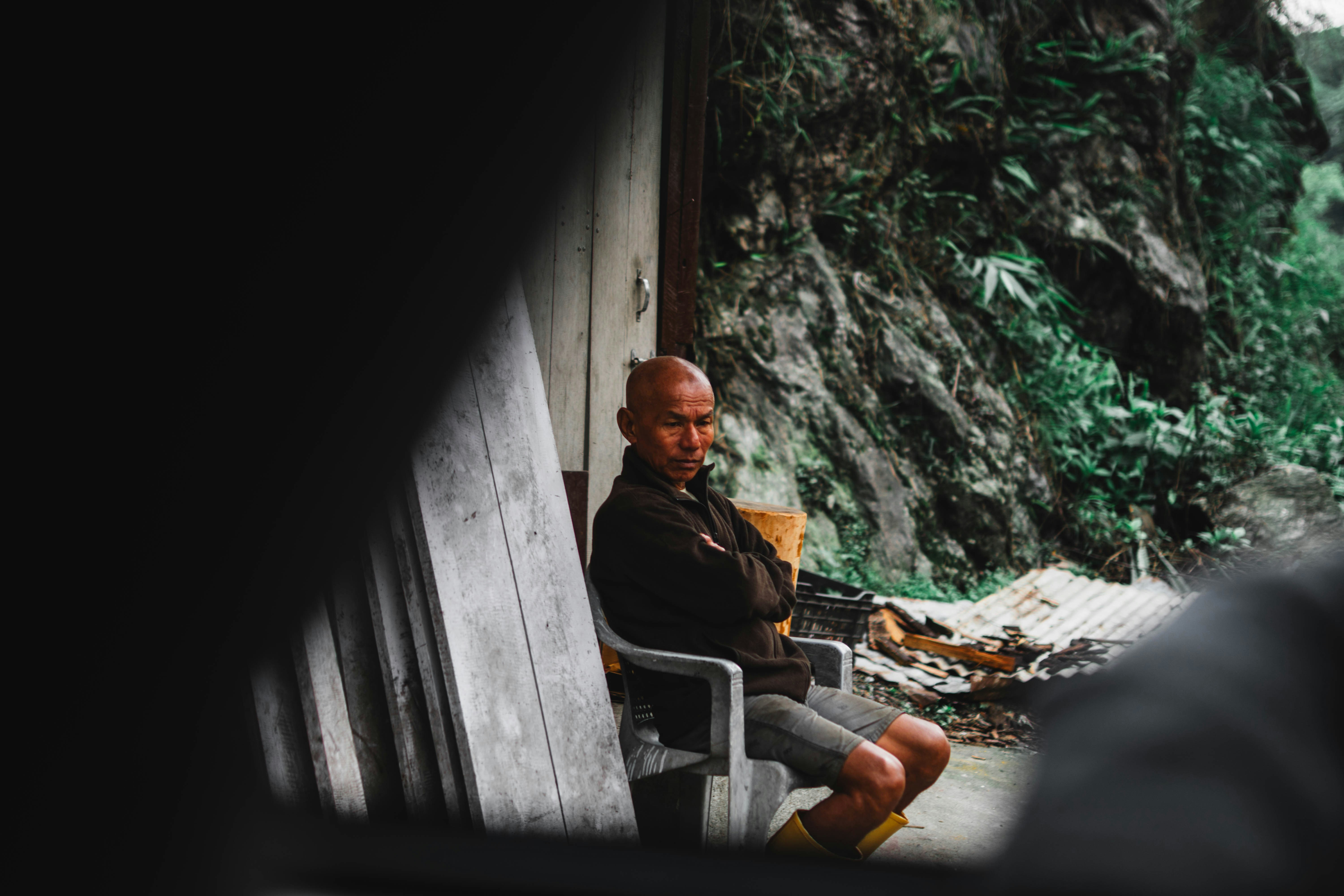 Quiet Solace: A Monk in the Shadows by the Mountain Path