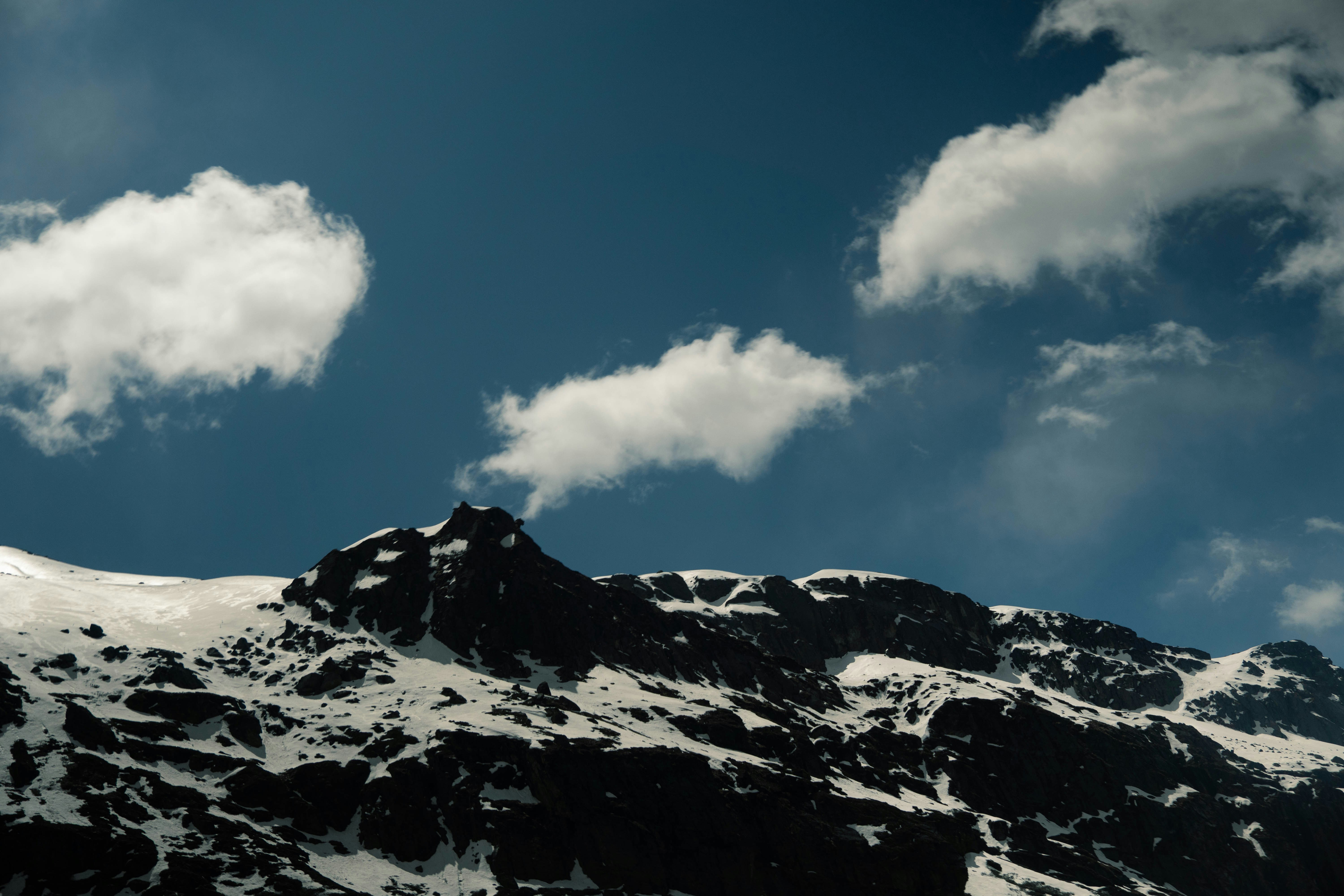 Snowfield Crowned Ridge Beneath a Clear Alpine Sky