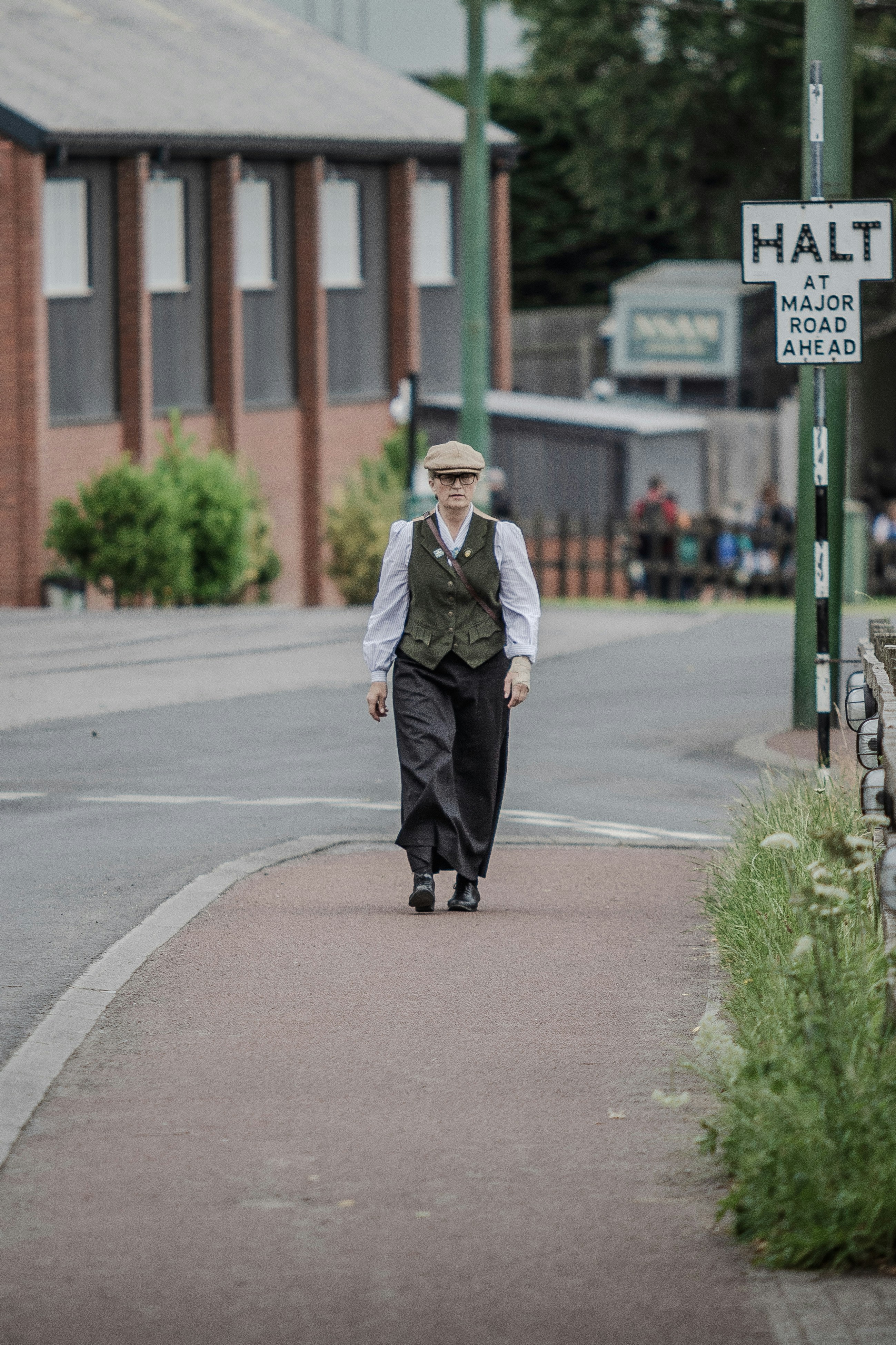 Pedestrian Crossing the Quiet Street in Retro Attire