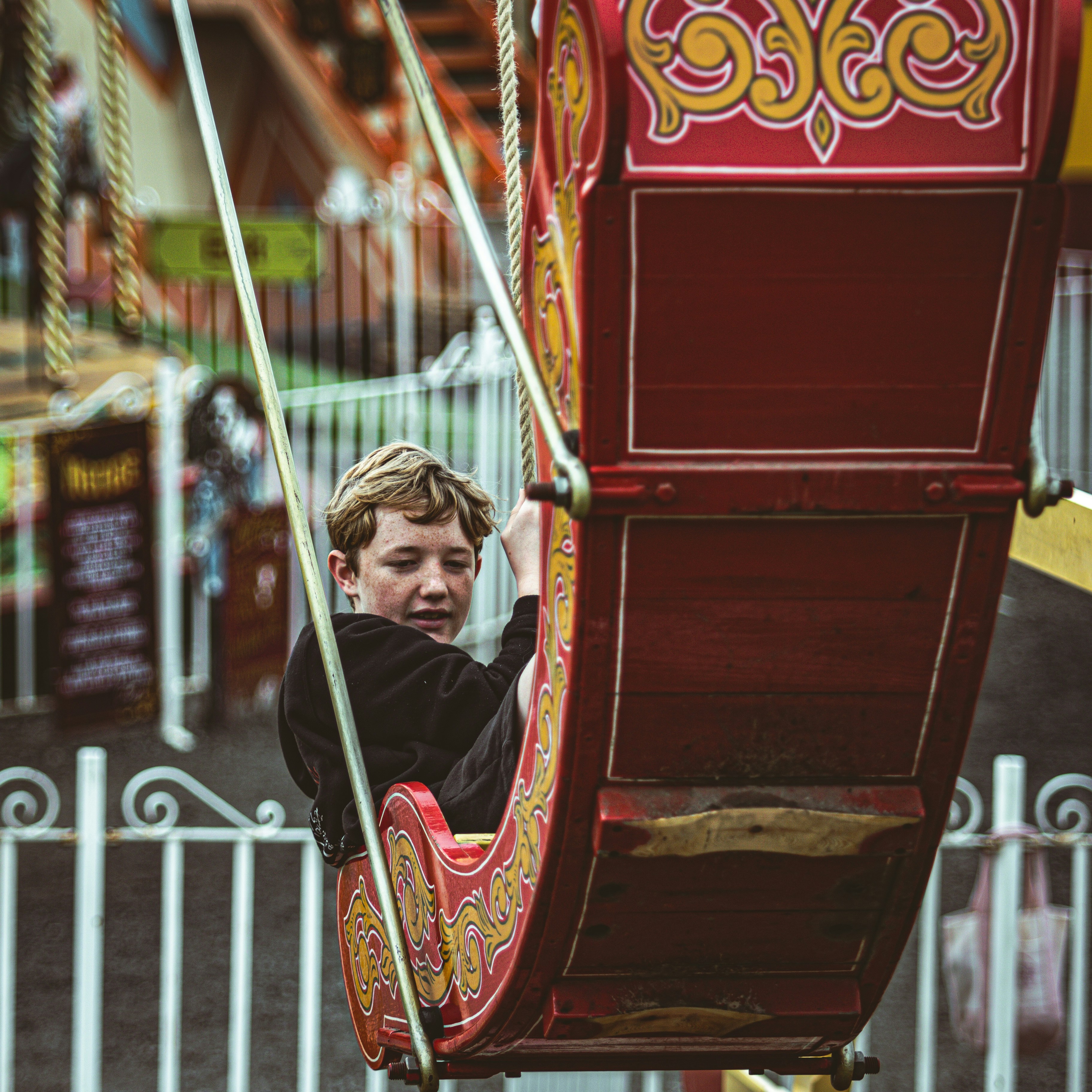 Boy's Quiet Focus in a Whimsy-Laden Ride