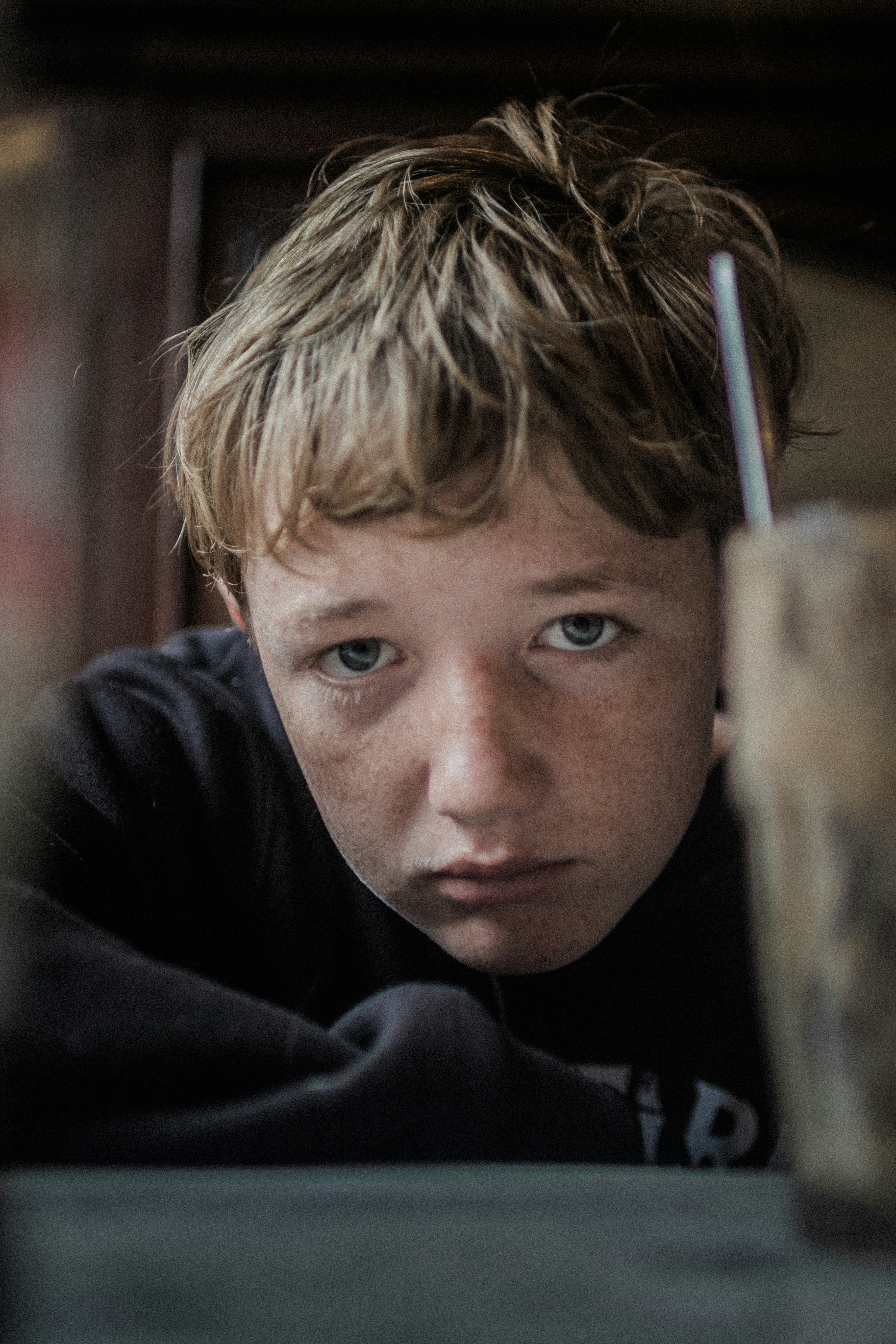 Eyes Between the Rails: A Quiet Portrait in Focus
