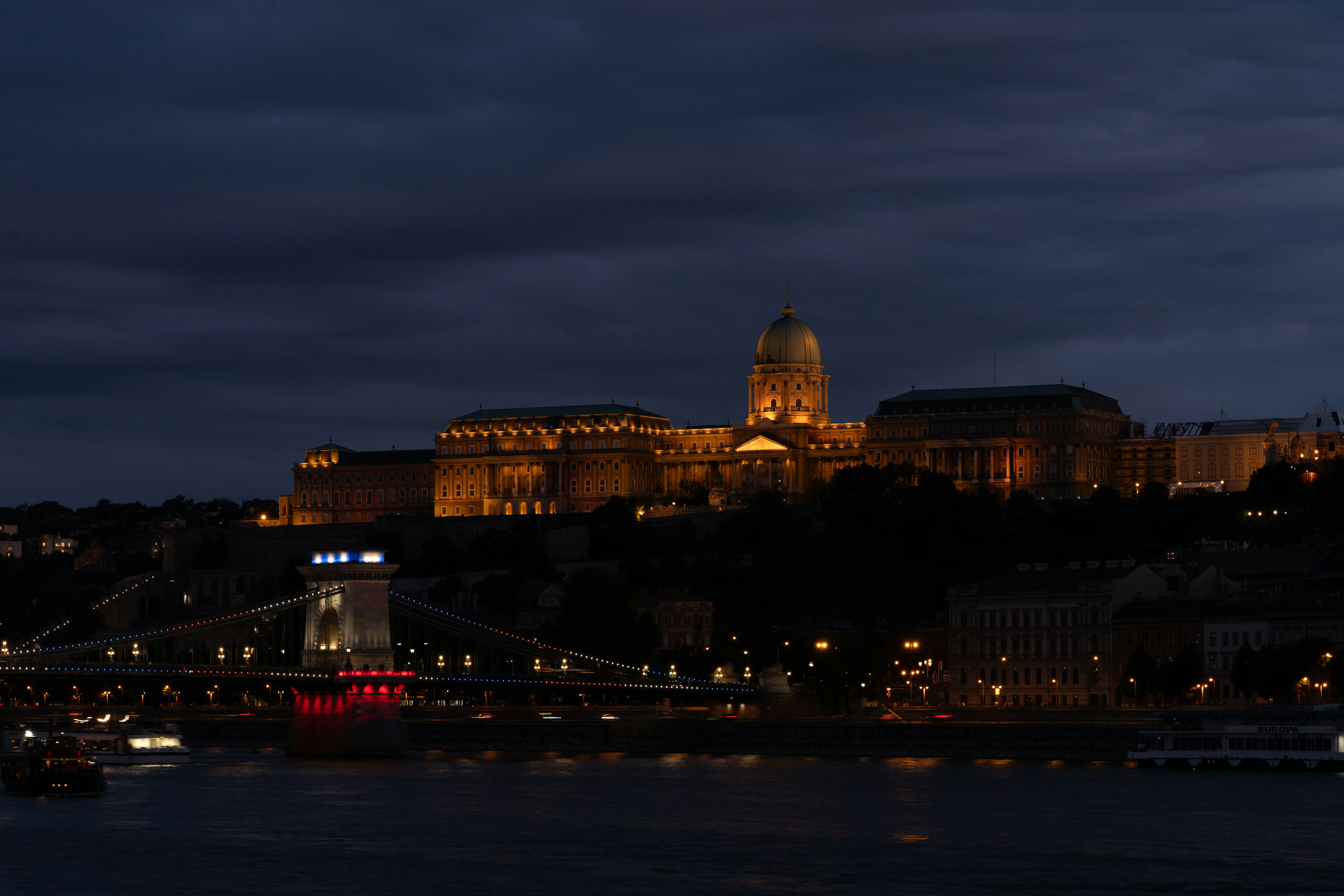 Illuminated Castle Over the Danube at Dusk