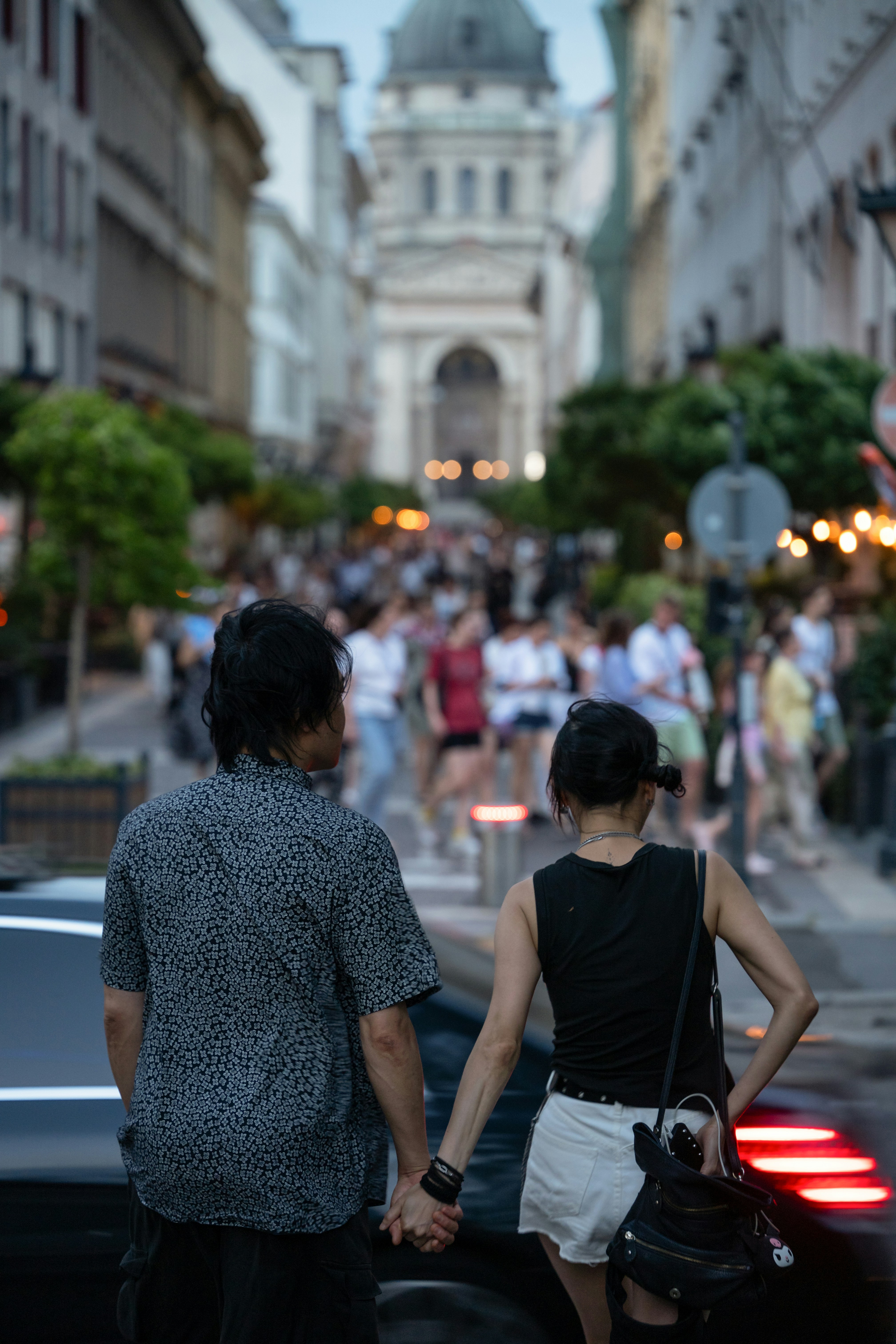 Evening Bloom in the Crossing: Lovers in a City of Footsteps