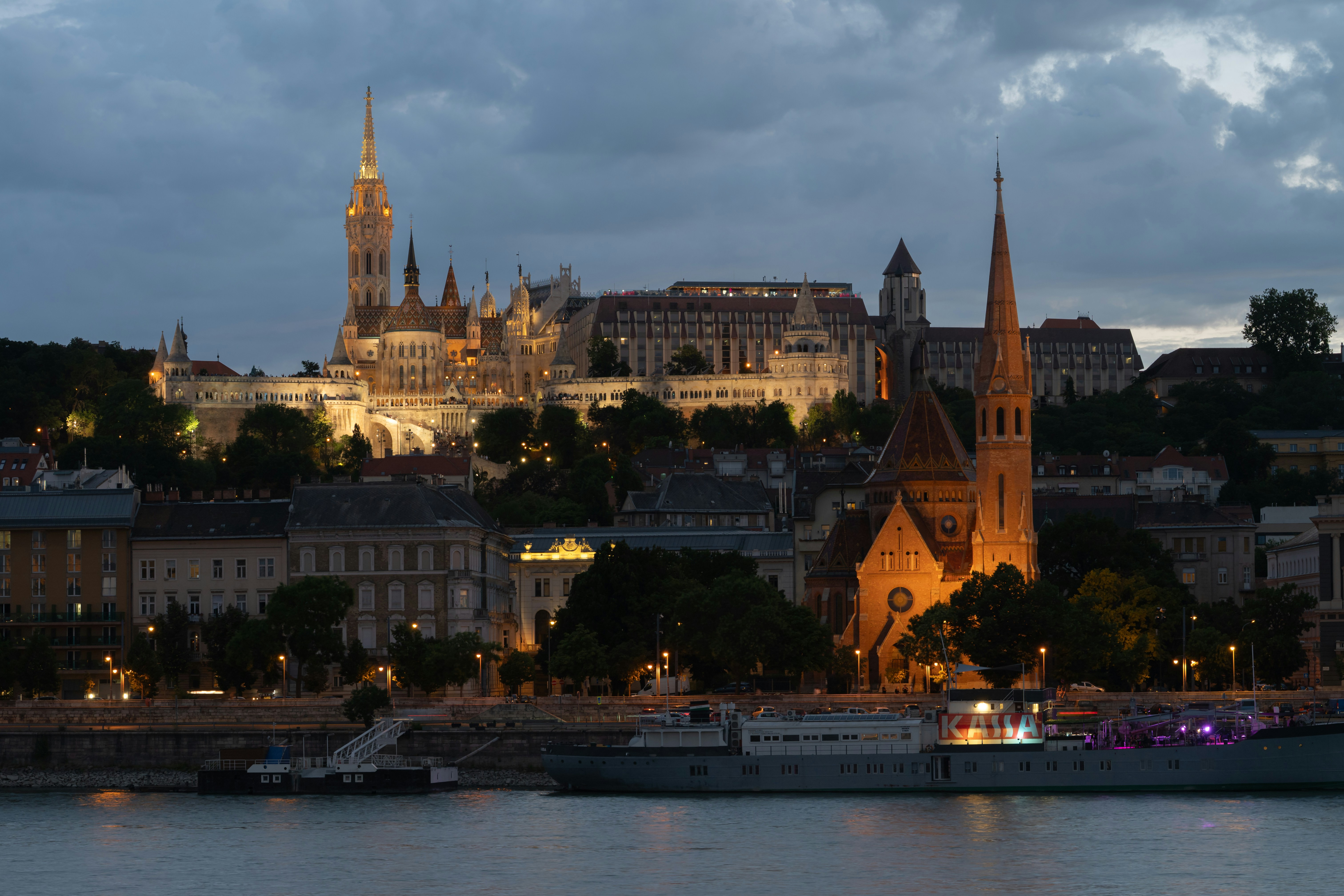 Golden Towers over the River: Evening Glow on a Historic Skyline