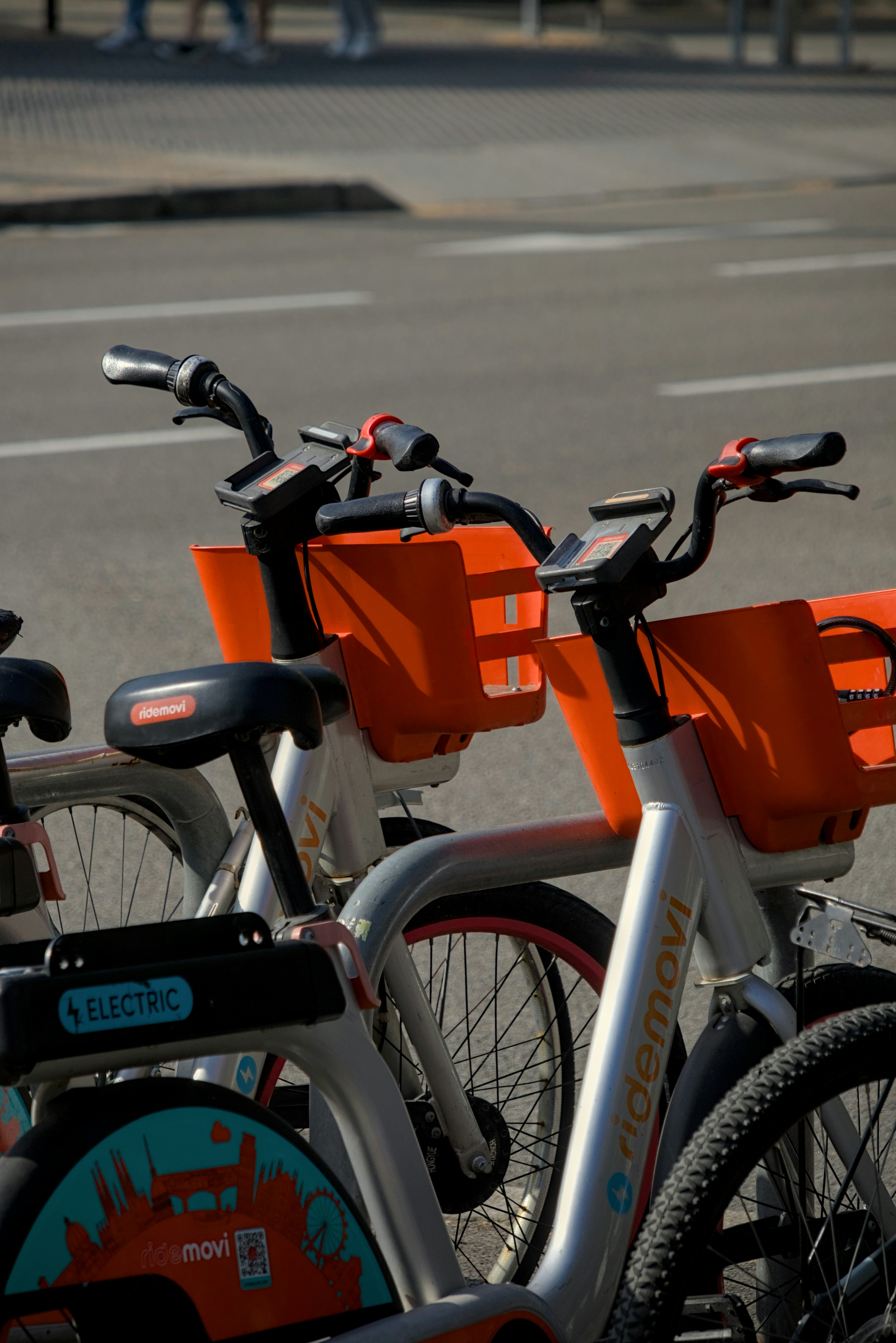 Orange Cargos of the City: Docked Bicycles Keepers of the Sidewalk