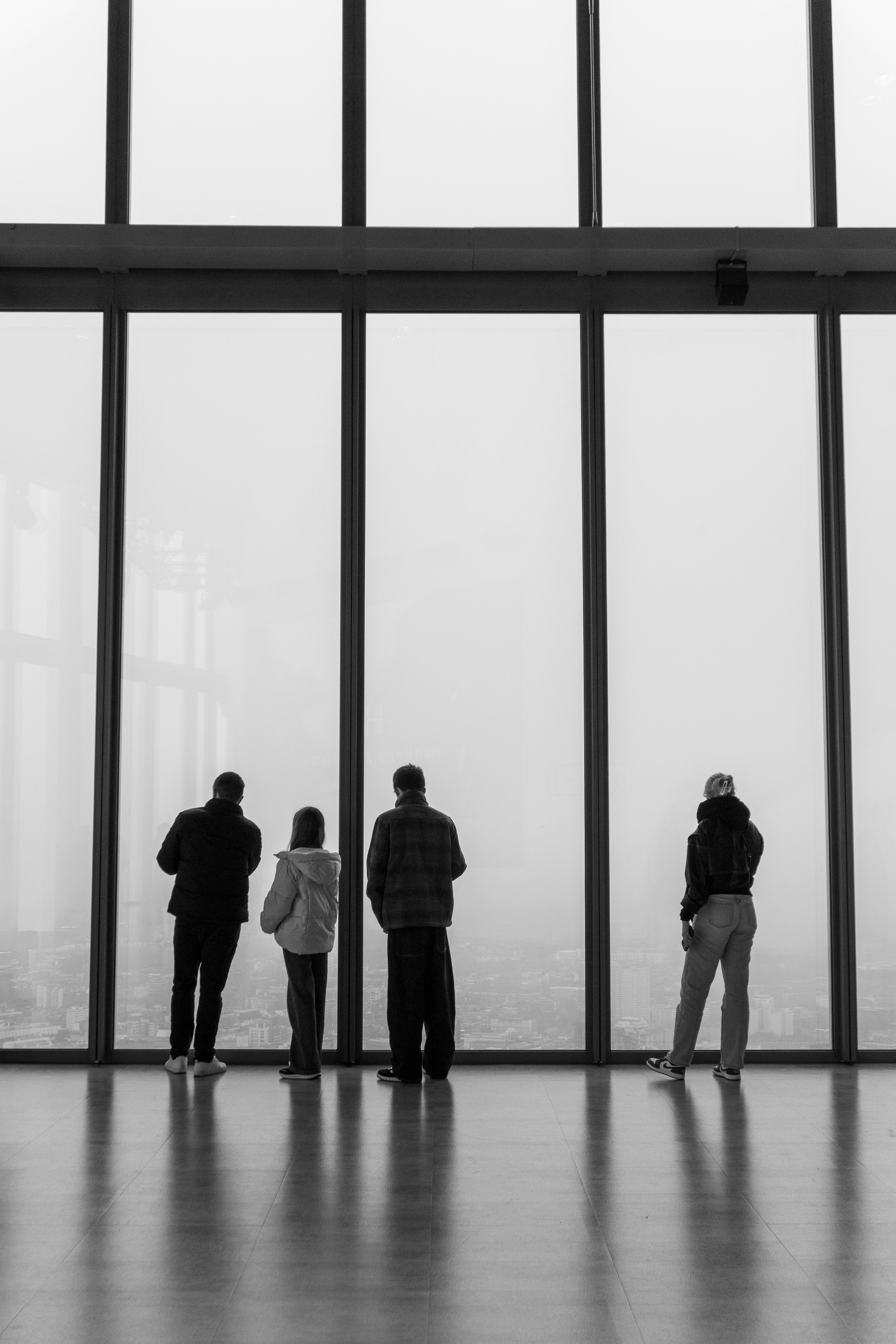 Standby at the Window: Four Figures in Monochrome Silence