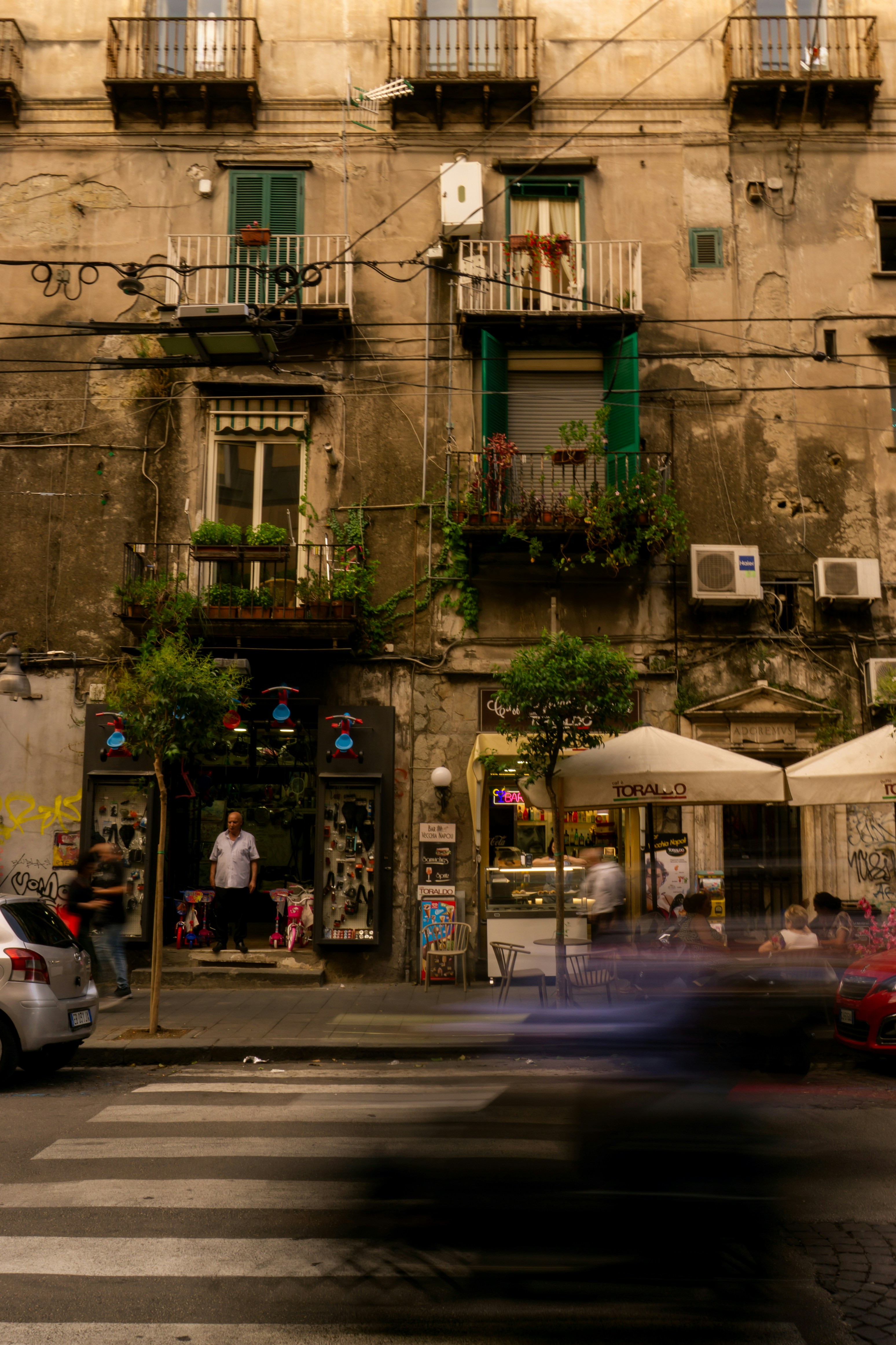 Urban Facade and Motion Blur Across a Lively Street