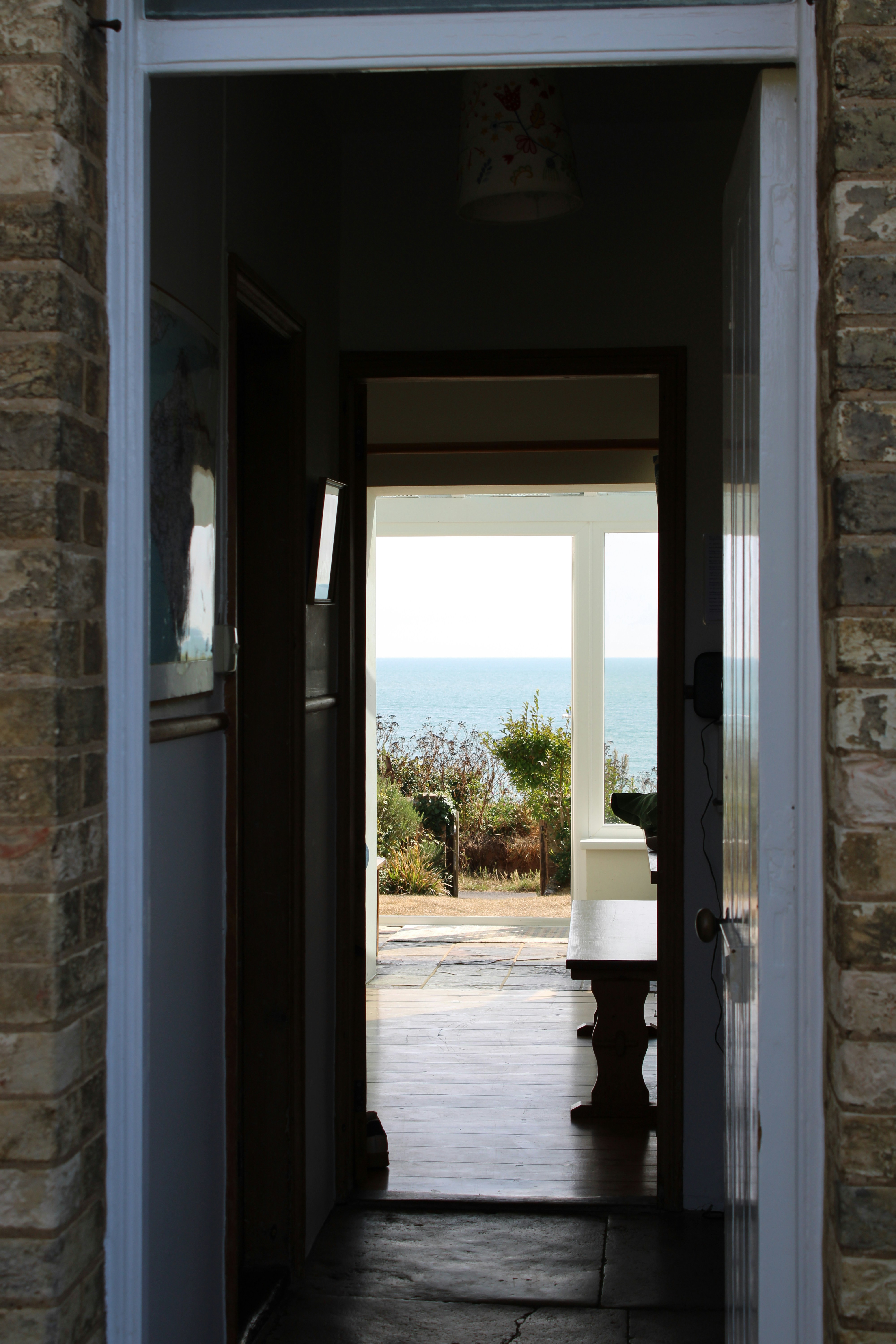 Doorway to the Sea: A Narrow Corridor Framing the Ocean View