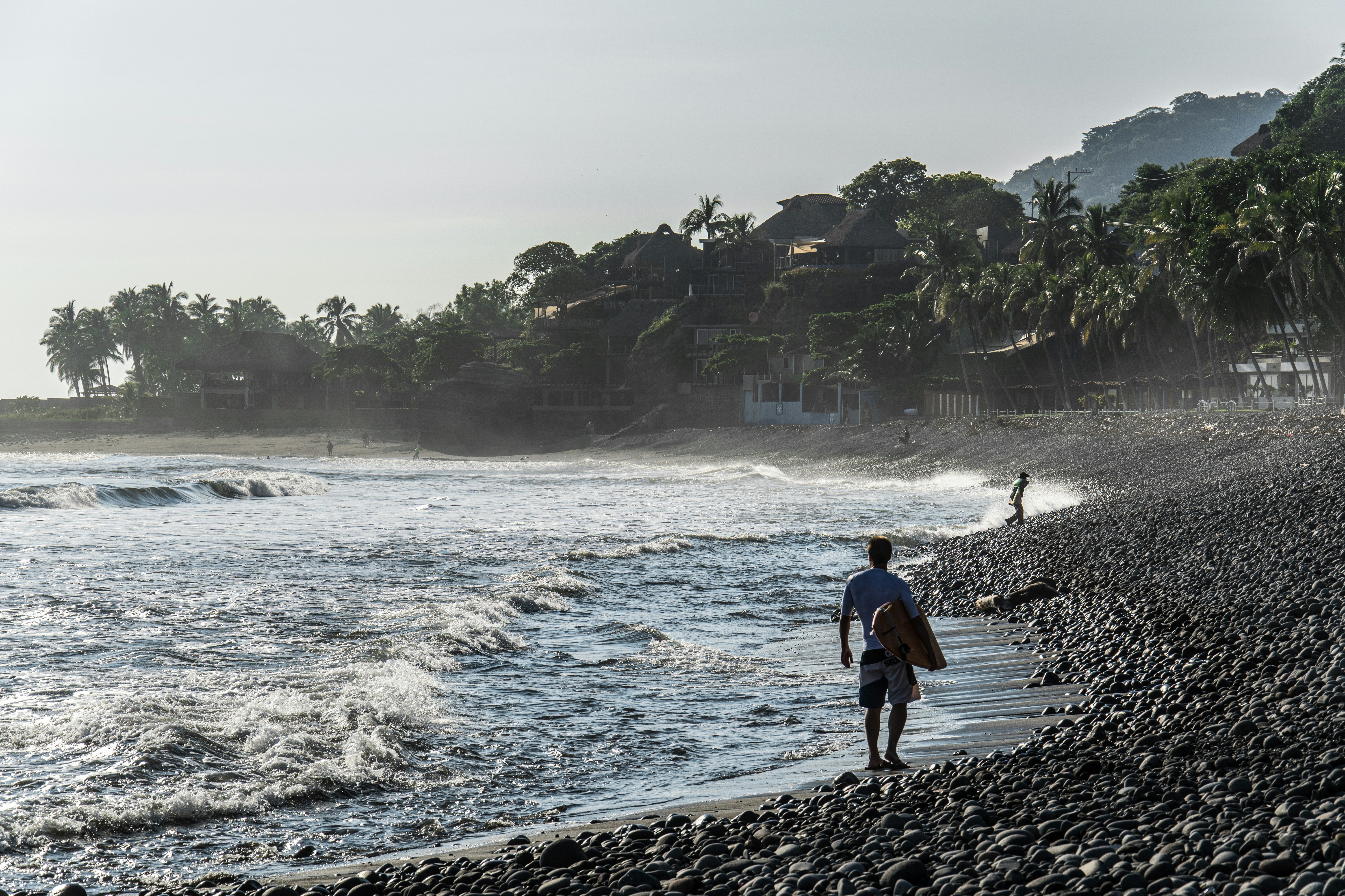 Surfer’s Silhouette at Dappled Shore