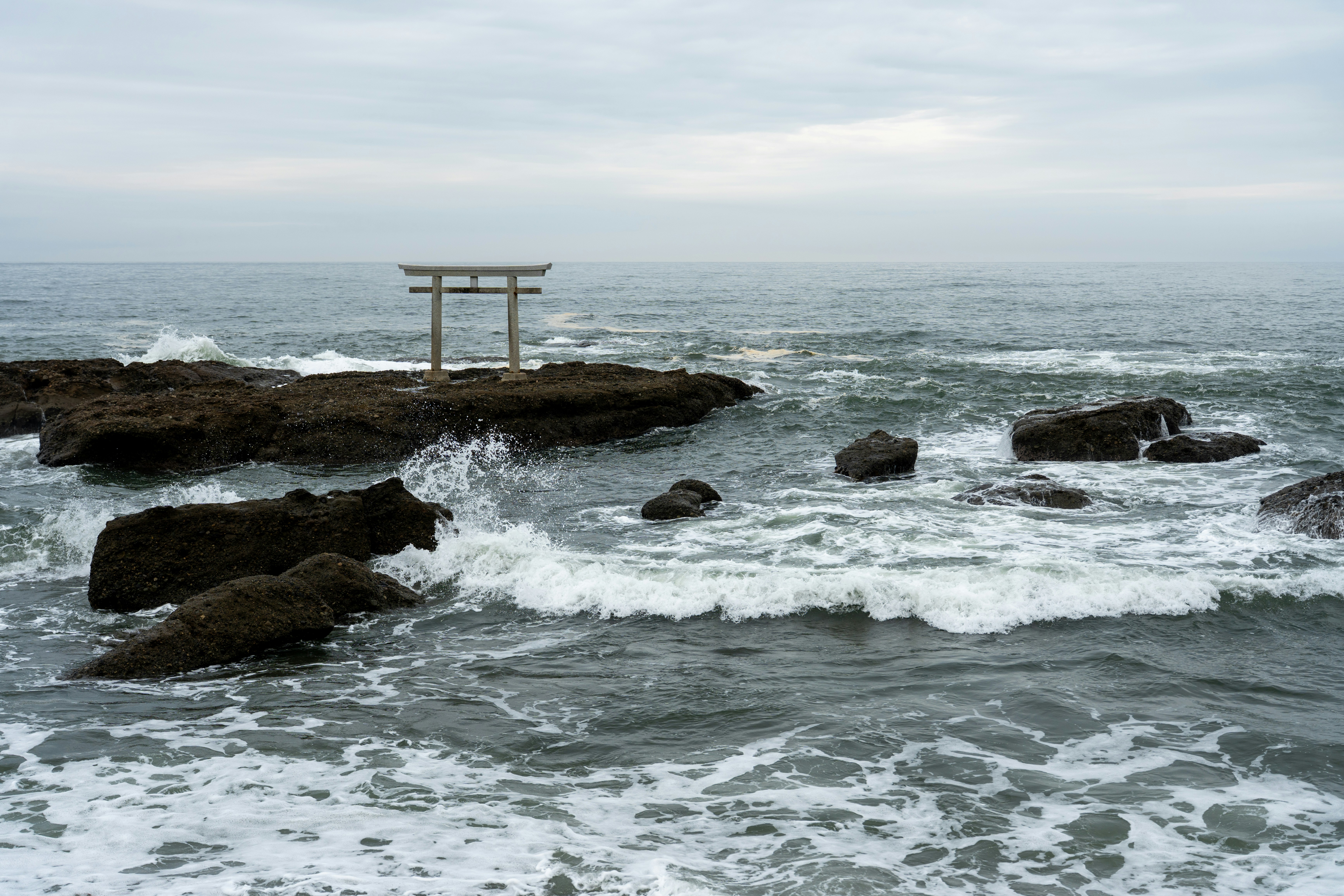 Torii Among Tidecarved Rocks