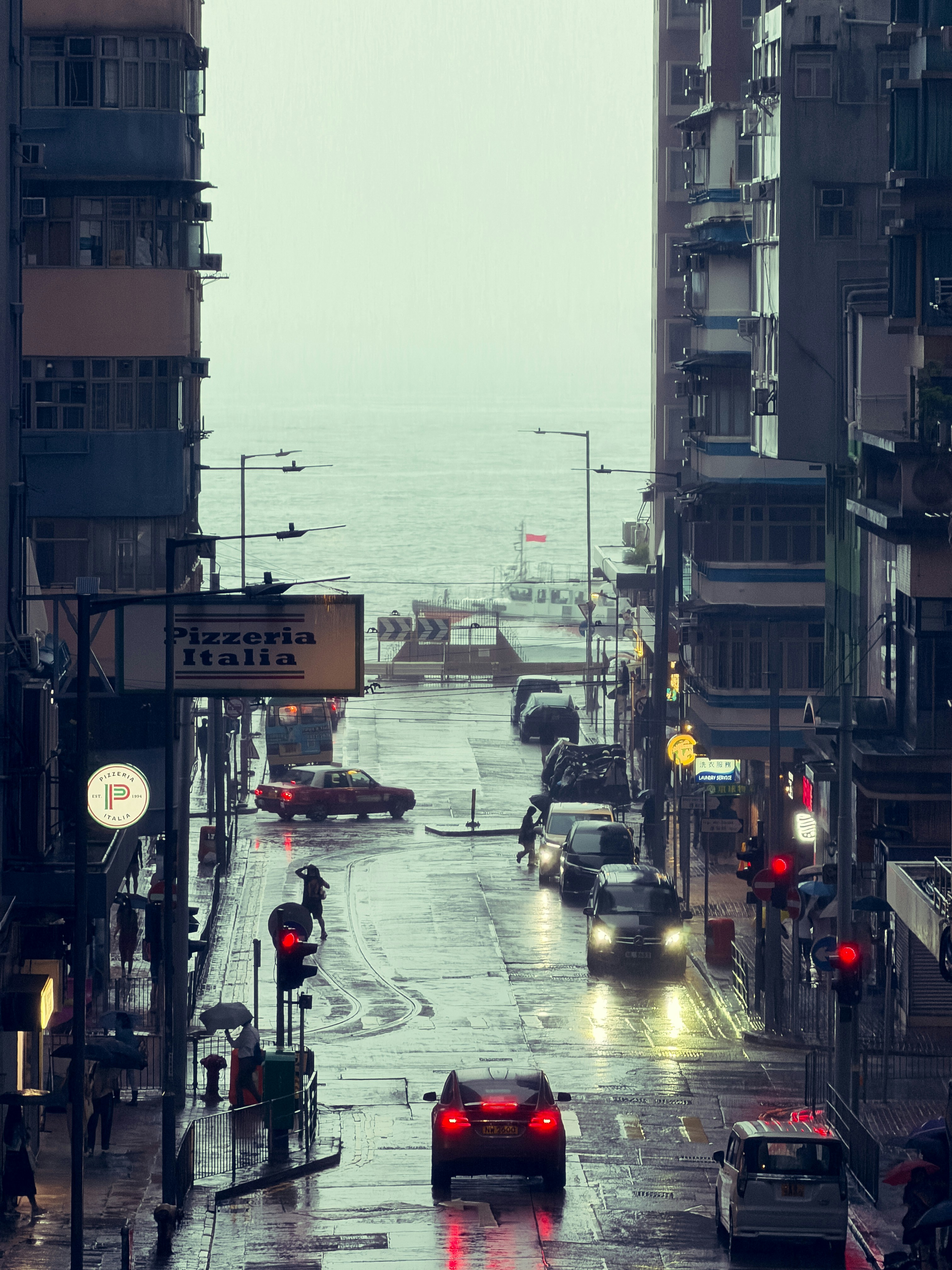 Rain-Slicked Street to the Sea: City Pulse and Red Taillights