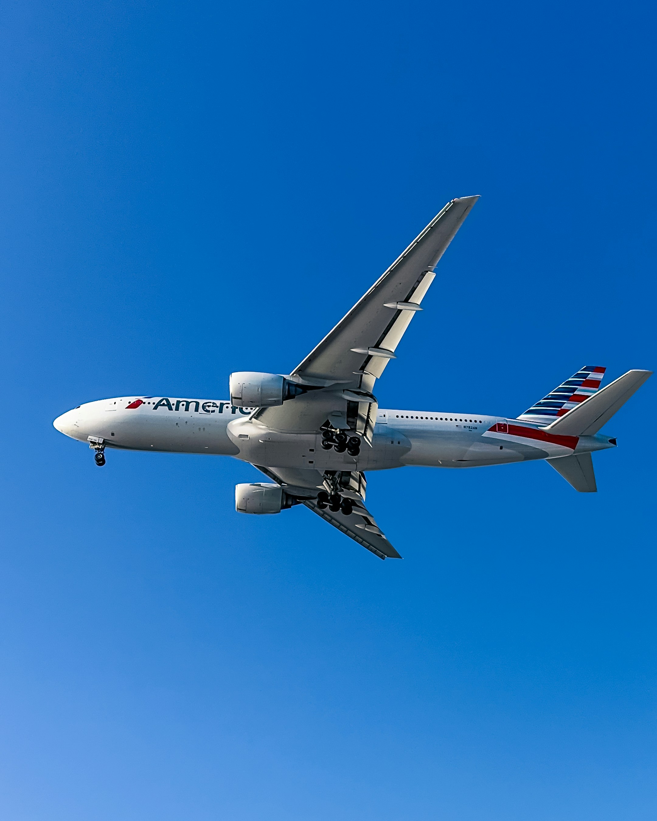 Airliner in a Clean Blue Sky: A Smooth Glide Overhead