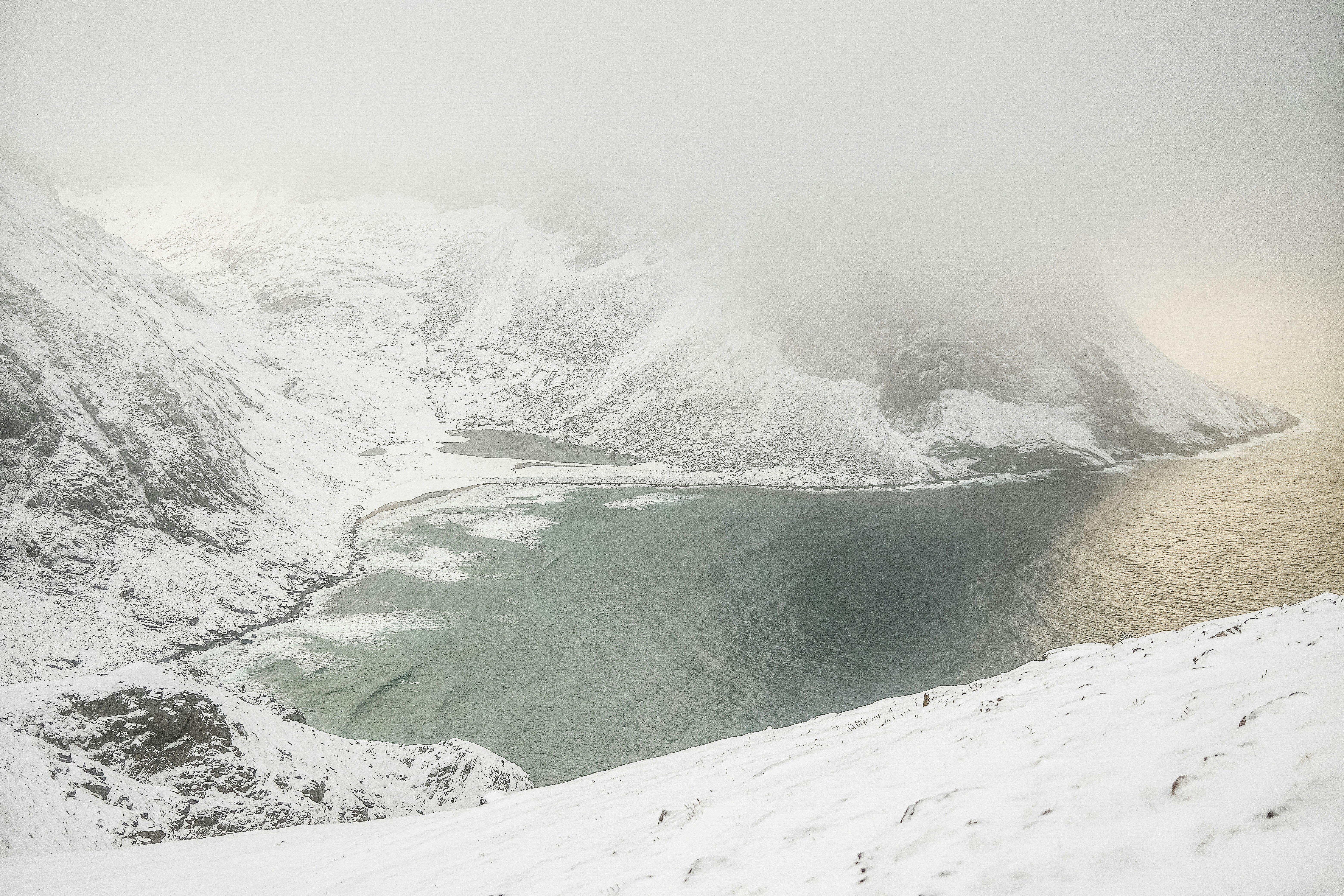Snowbound Inlet: A Quiet Confluence Between Ice, Sea, and Mist