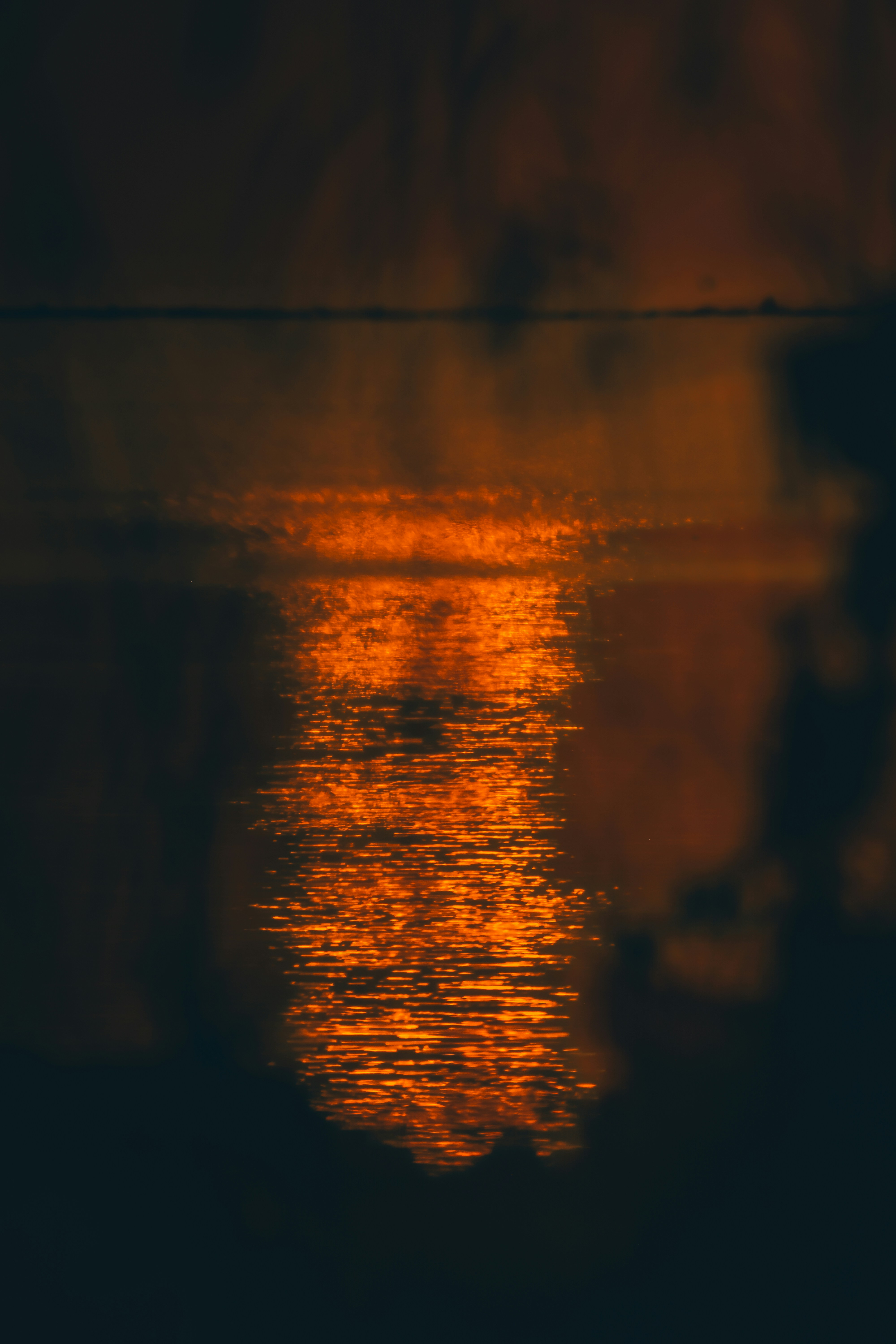 Reflection of Neon Fire on Quiet Water