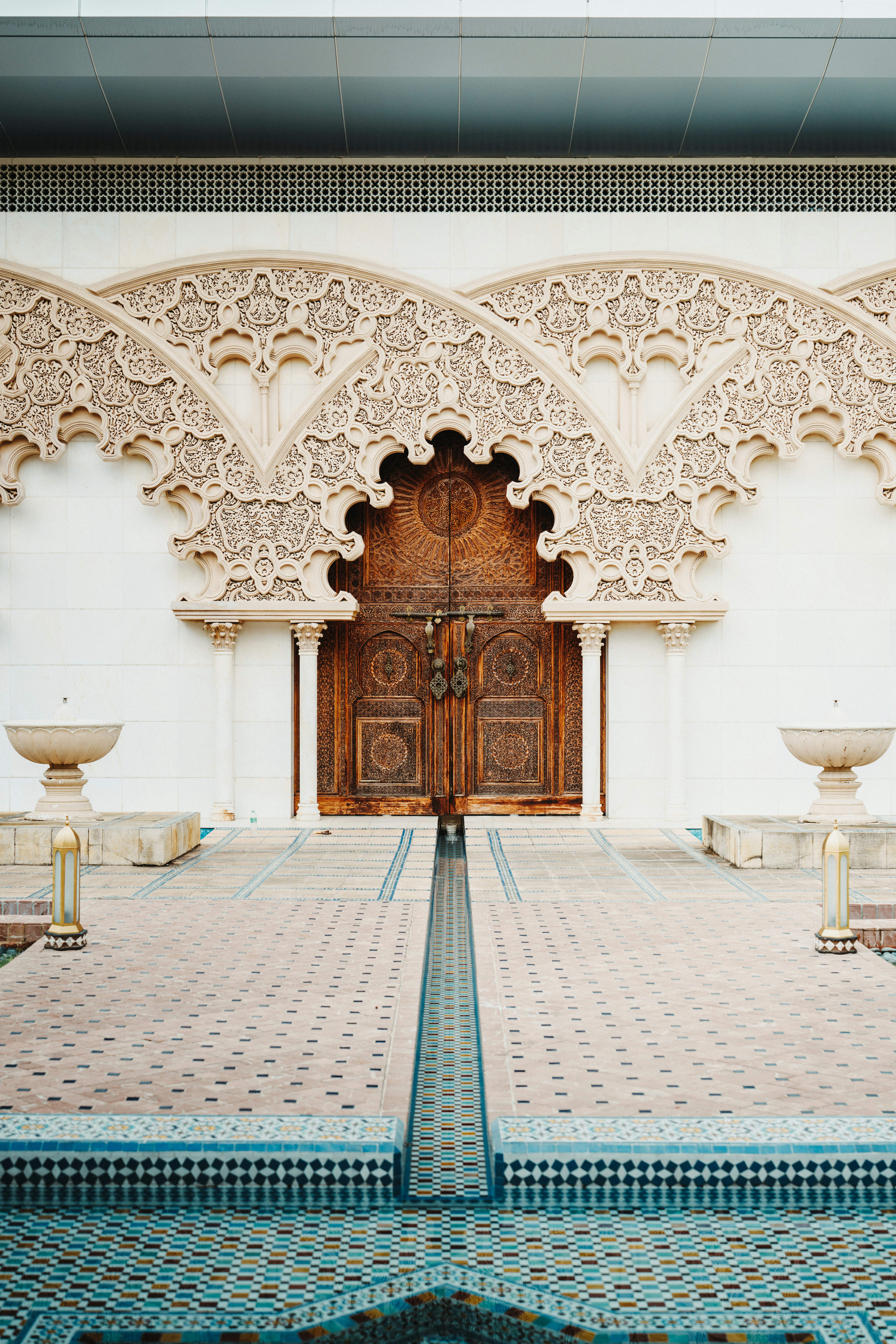 Intricate Moorish Portal Framed by Marble Foyer