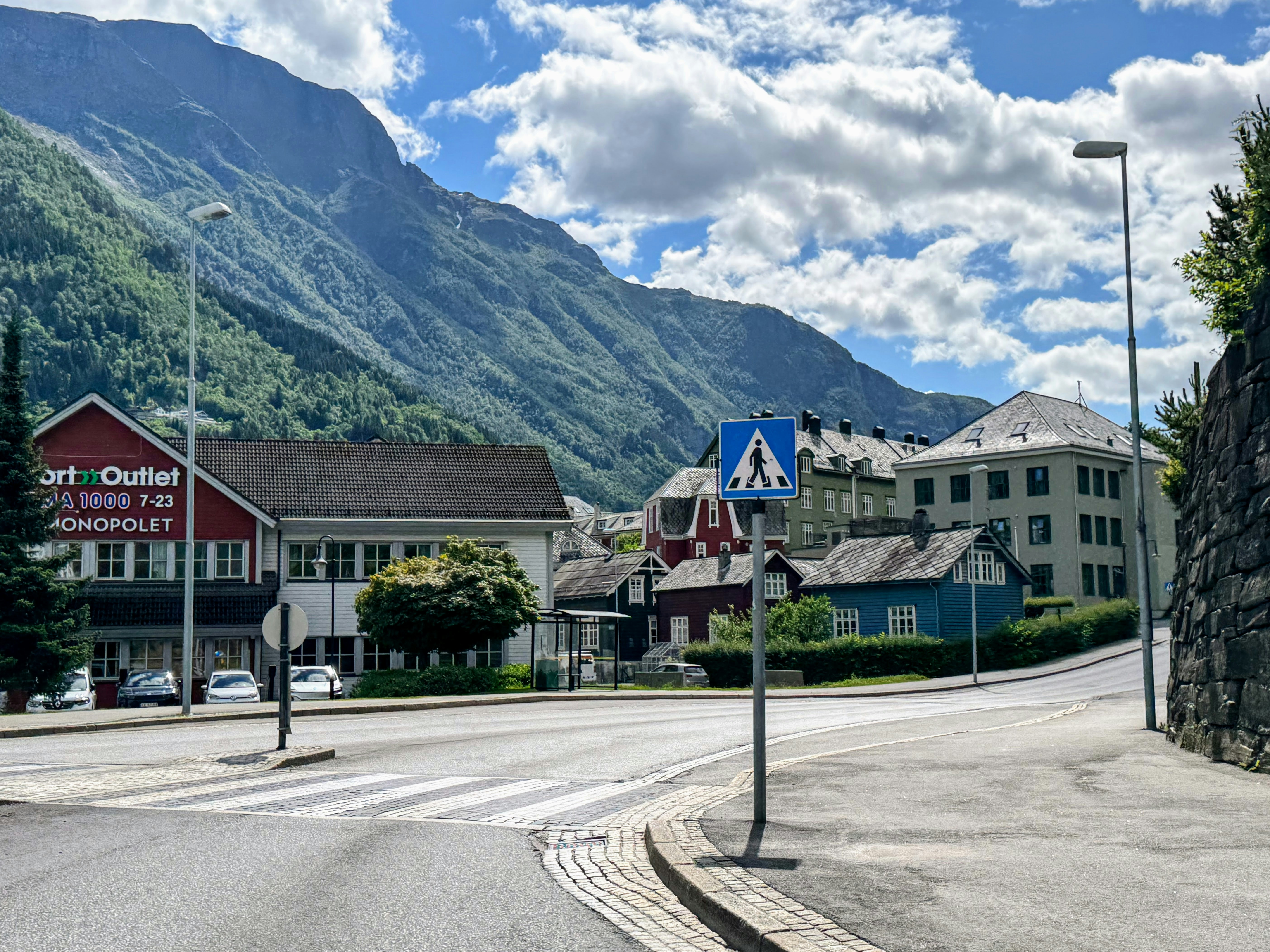 Nordic Street in Shadow of Alpine Peaks