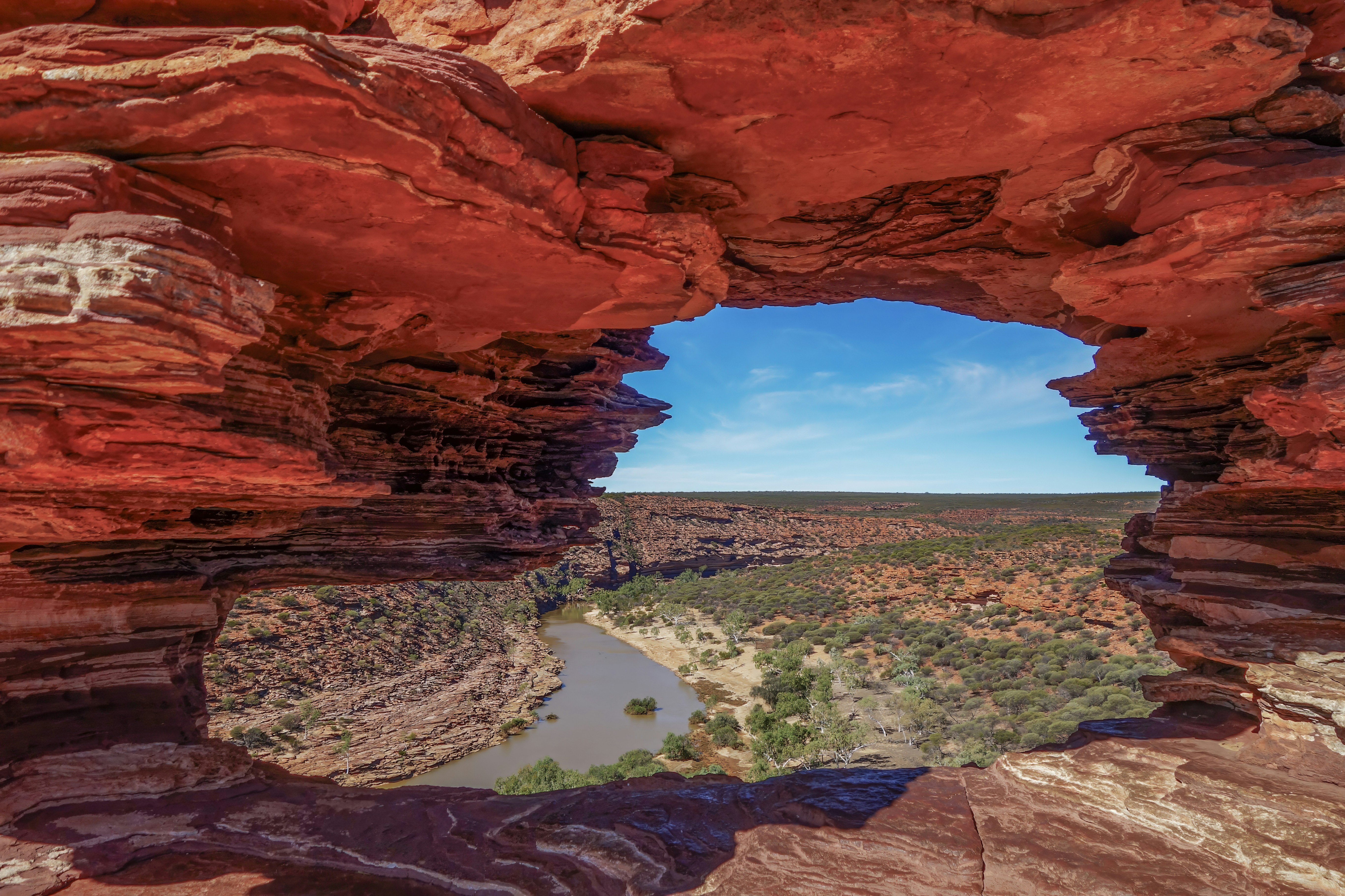 Red Arch Aperture Overlooking a Desert River
