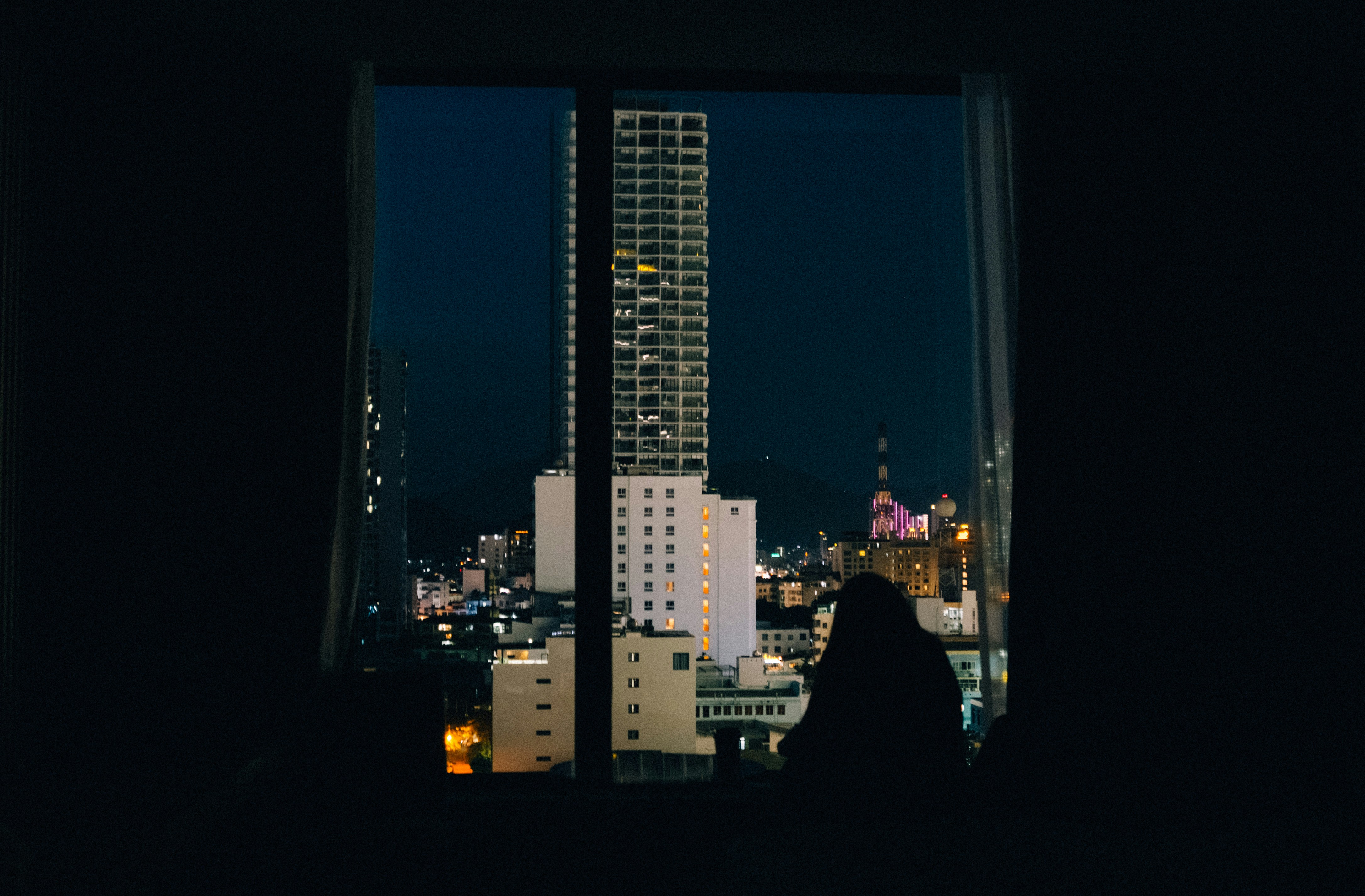 Midnight Window to a City Silhouette