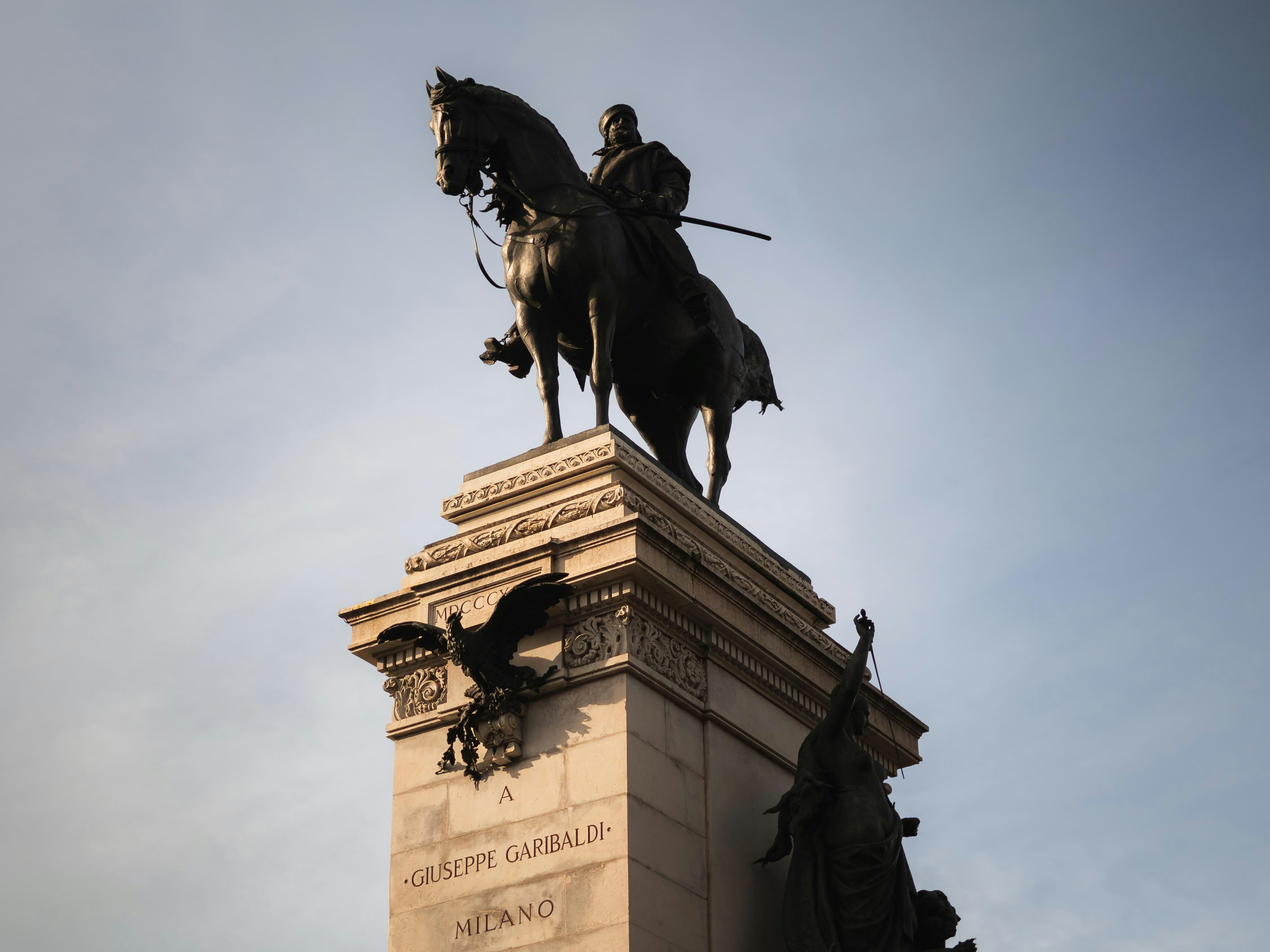Equestrian Monument at Dusk: A Silhouette Over a Sculpted Pedestal